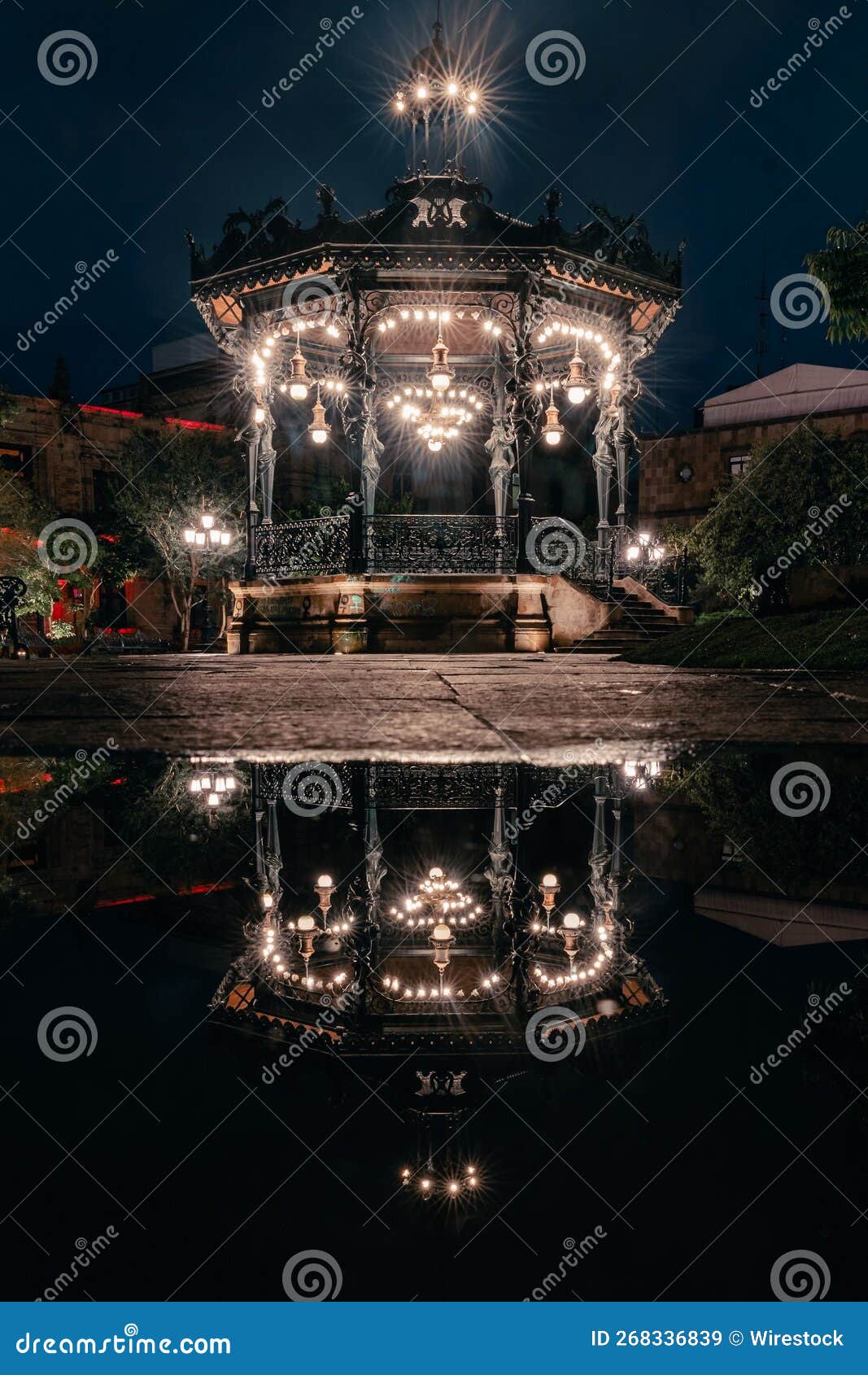 Vertical of the Reflection of the Illuminated Kiosko Plaza De Armas in ...