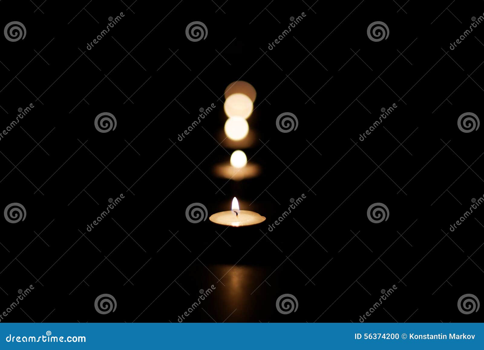 Vertical Row of Candles Burning in the Darkness Stock Photo - Image of ...