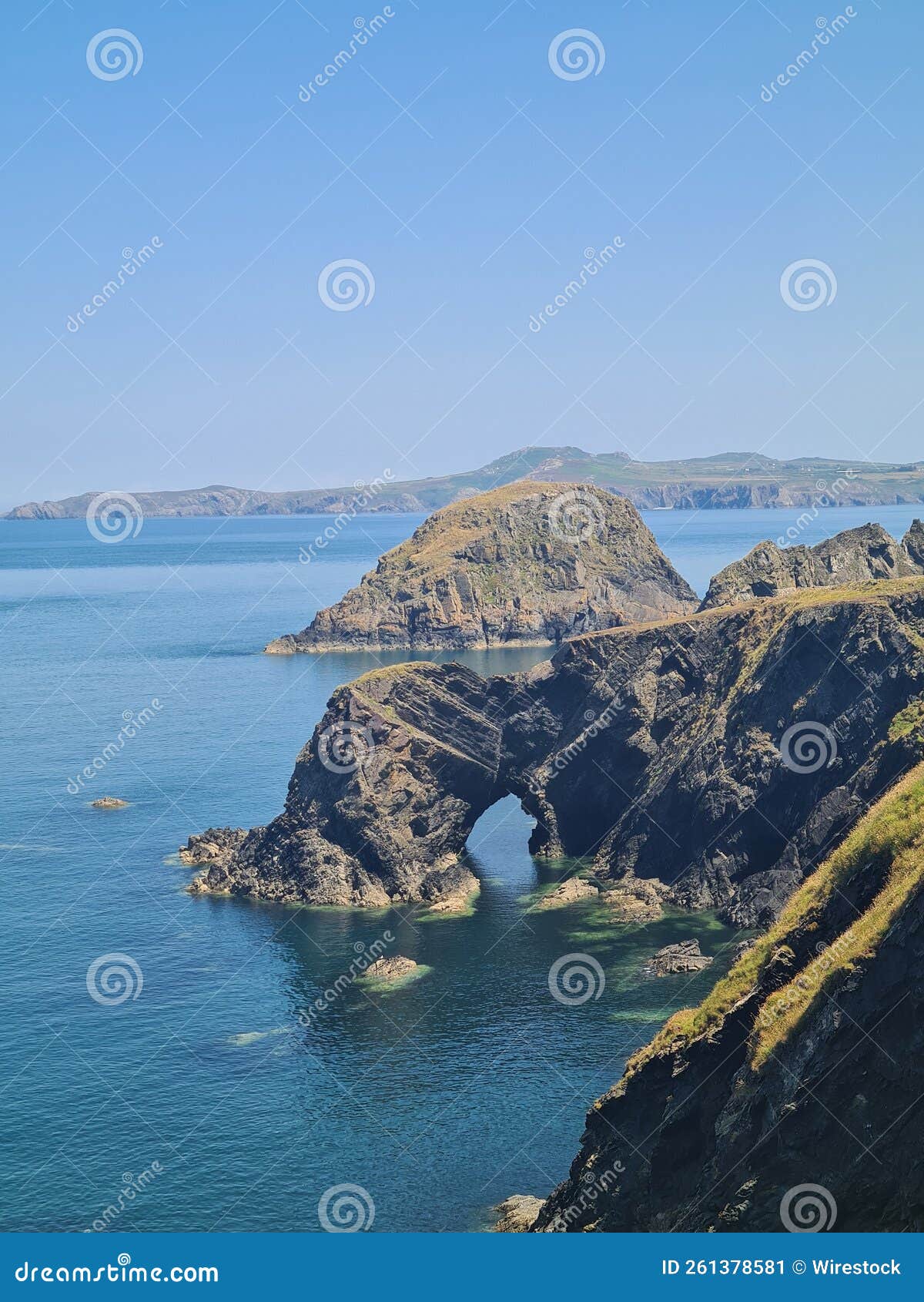 Vertical of Sea Arches in the Ocean Under the Blue Sky on Daylight ...
