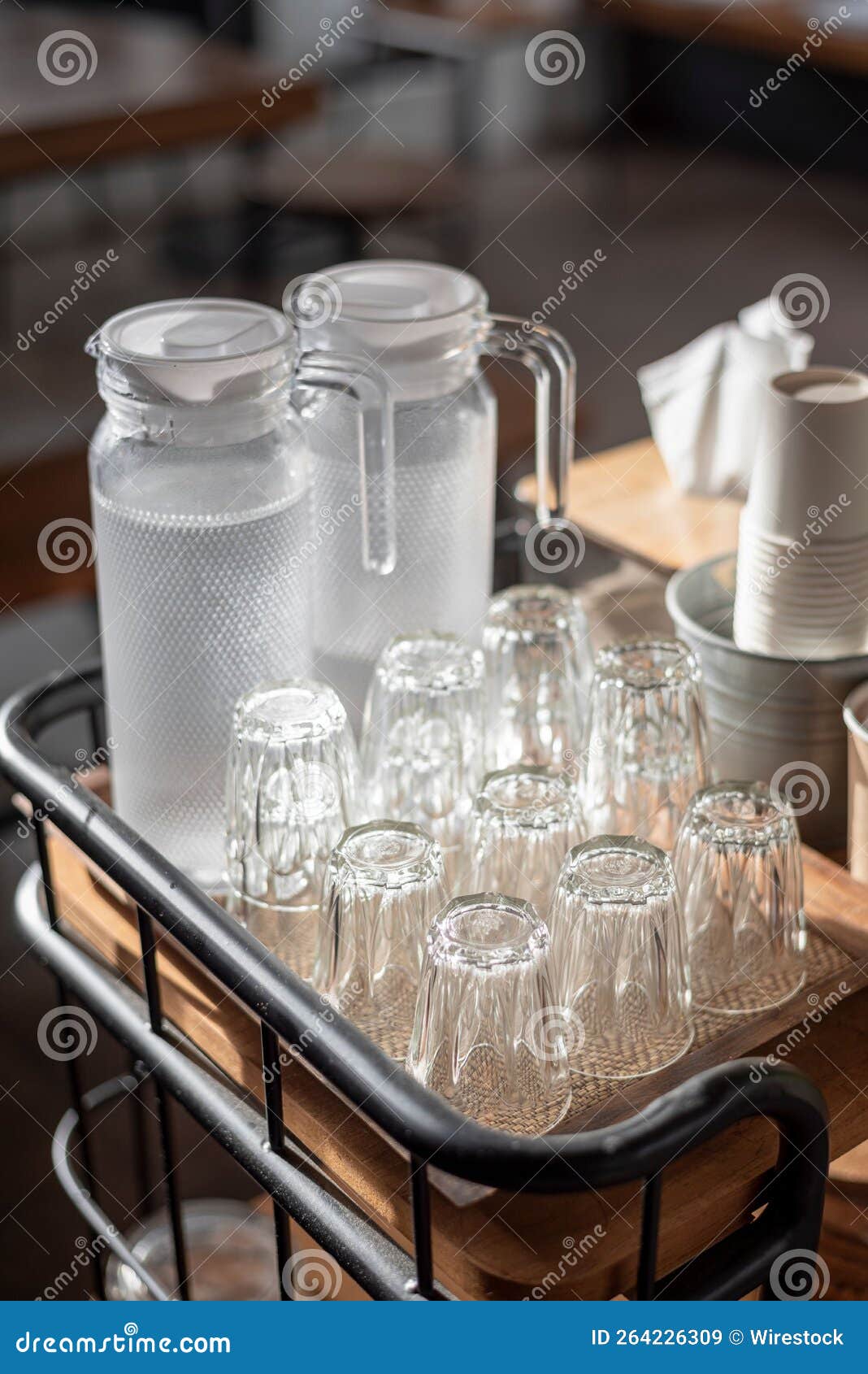 Vertical Selective Focus Shot of Glass Water Pitchers and Empty Upside ...