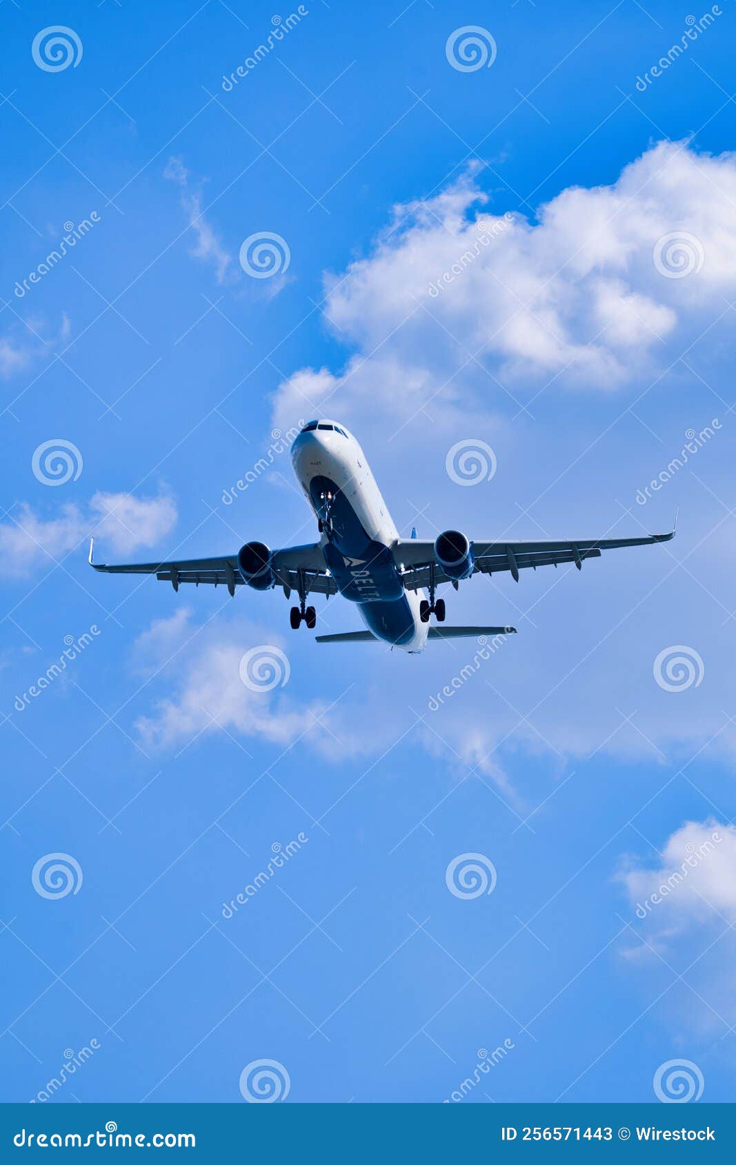 Vertical Shot of an Airplane Flying Overhead Editorial Stock Photo ...