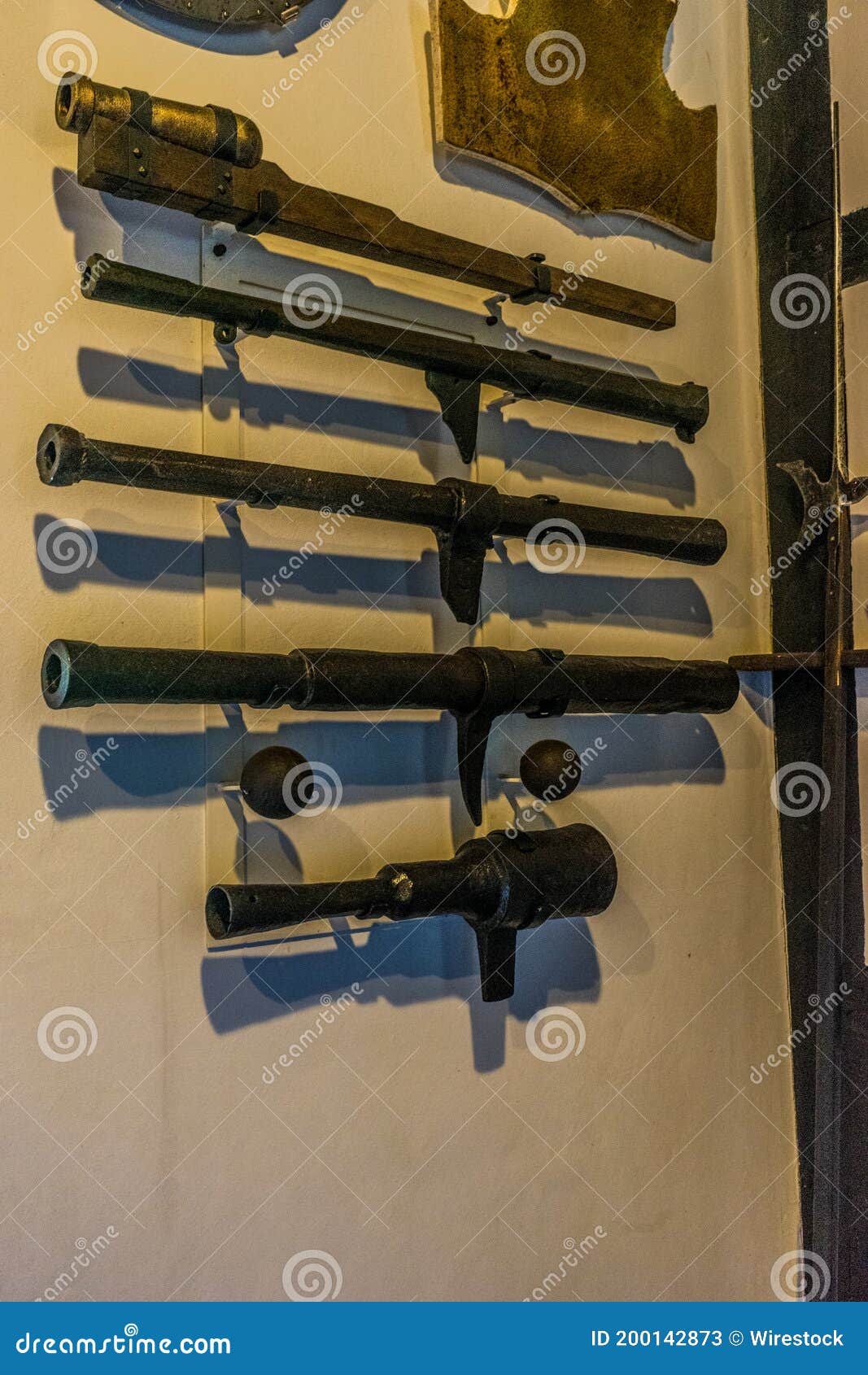 Vertical Shot of Ancient Weapons on Display at a Museum Editorial Stock ...