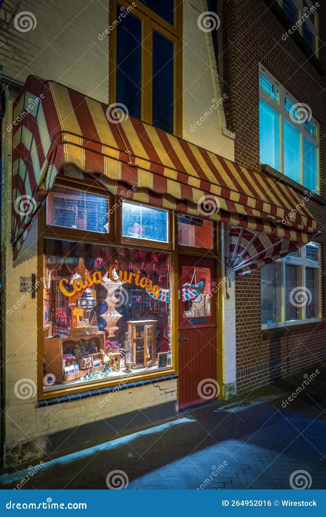 Vertical Shot of an Antique Store at Night Stock Photo - Image of style ...
