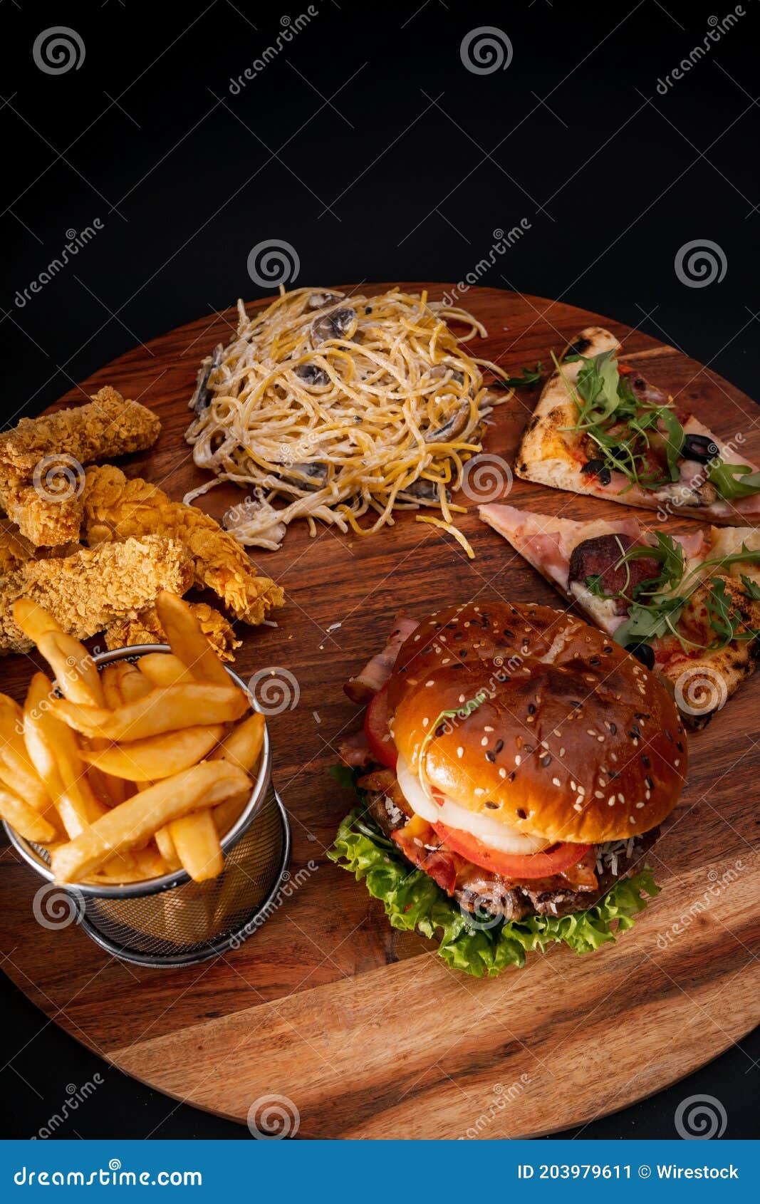 Vertical Shot of Assorted Fast Food on a Wooden Surface Stock Image ...