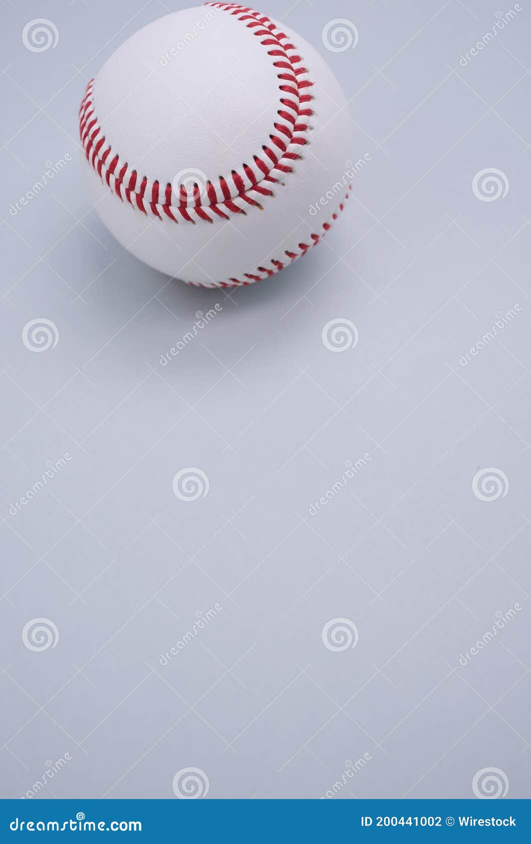 Vertical Shot of a Baseball Ball Isolated on Light Blue Background ...