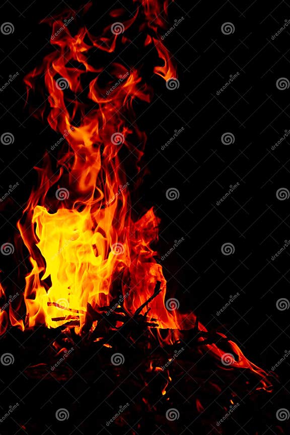 Vertical Shot of a Beautiful Burning Fire at Night Stock Photo - Image ...