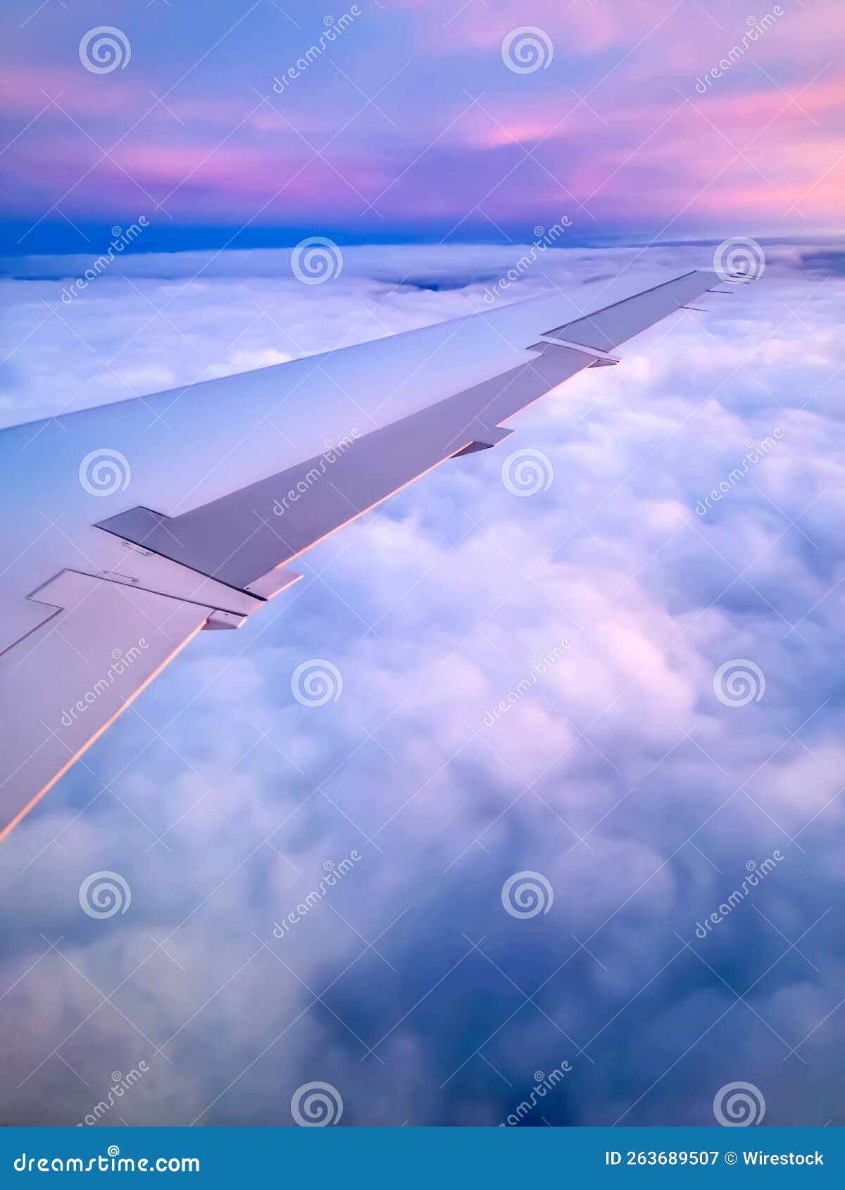 Vertical Shot of a Beautiful Cloudscape Seen from a Plane Window with a ...