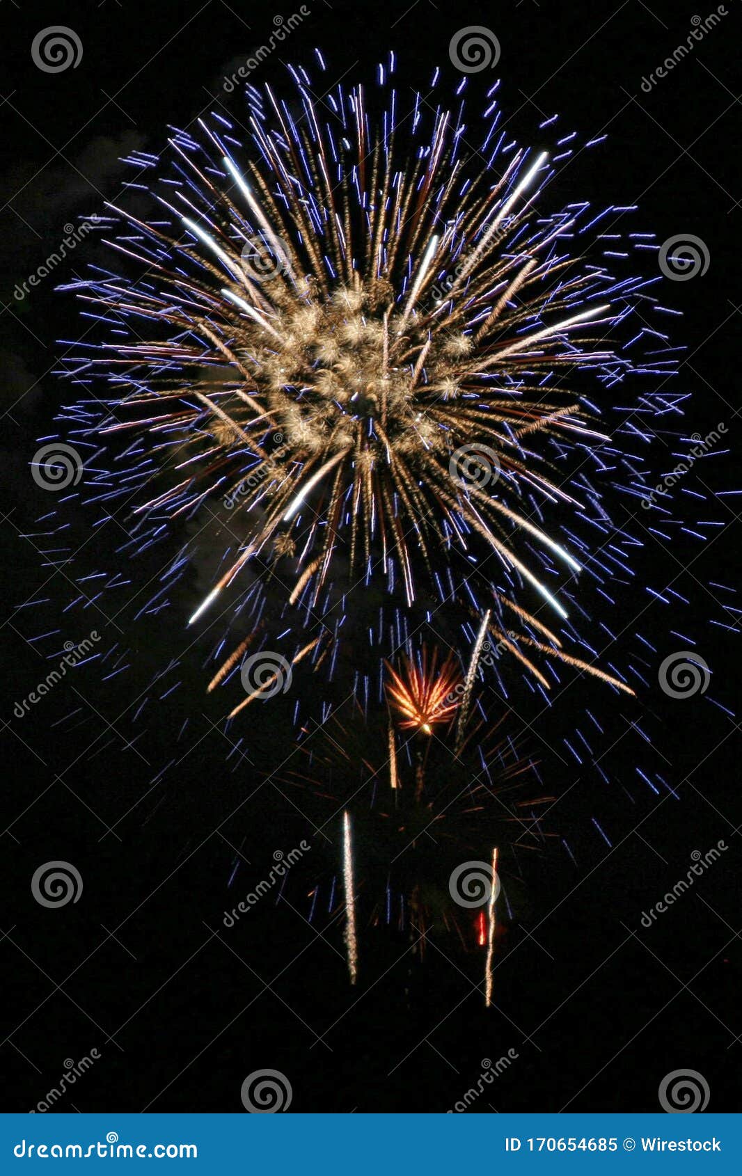 Vertical Shot of Beautiful Fireworks Display in a Cold Night Sky Stock ...