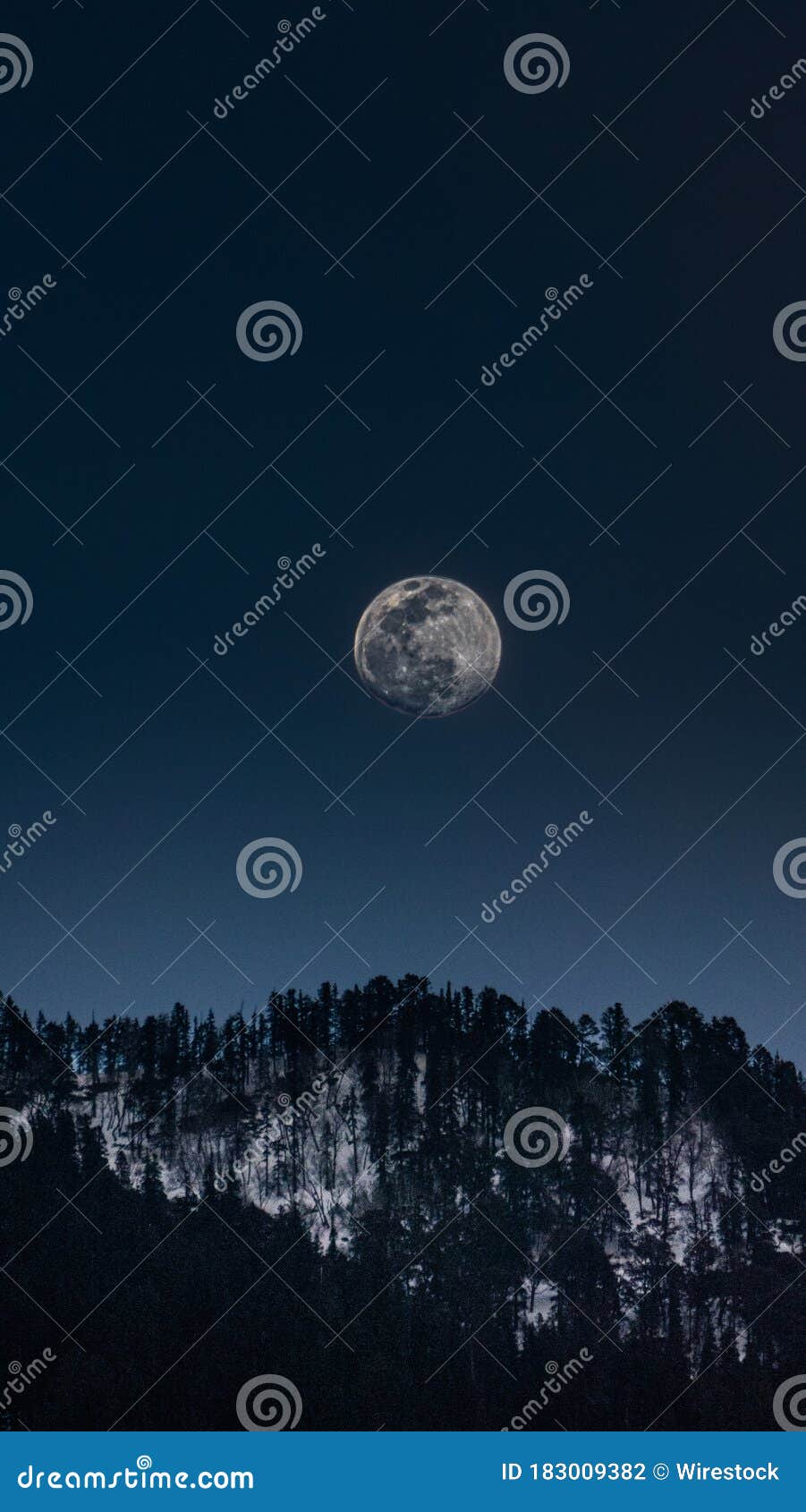 Vertical Shot of the Beautiful Full Moon Rising in the Mountains Stock ...