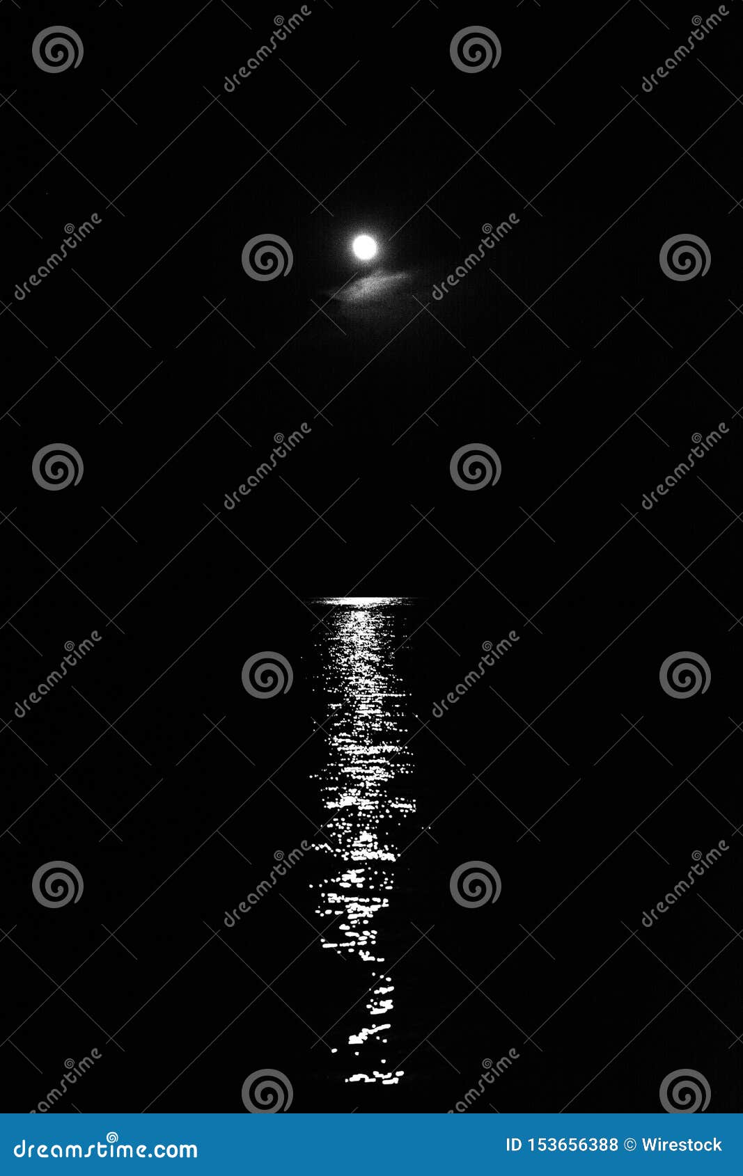 Vertical Shot of the Beautiful Full Moonlight and the Reflection in the ...