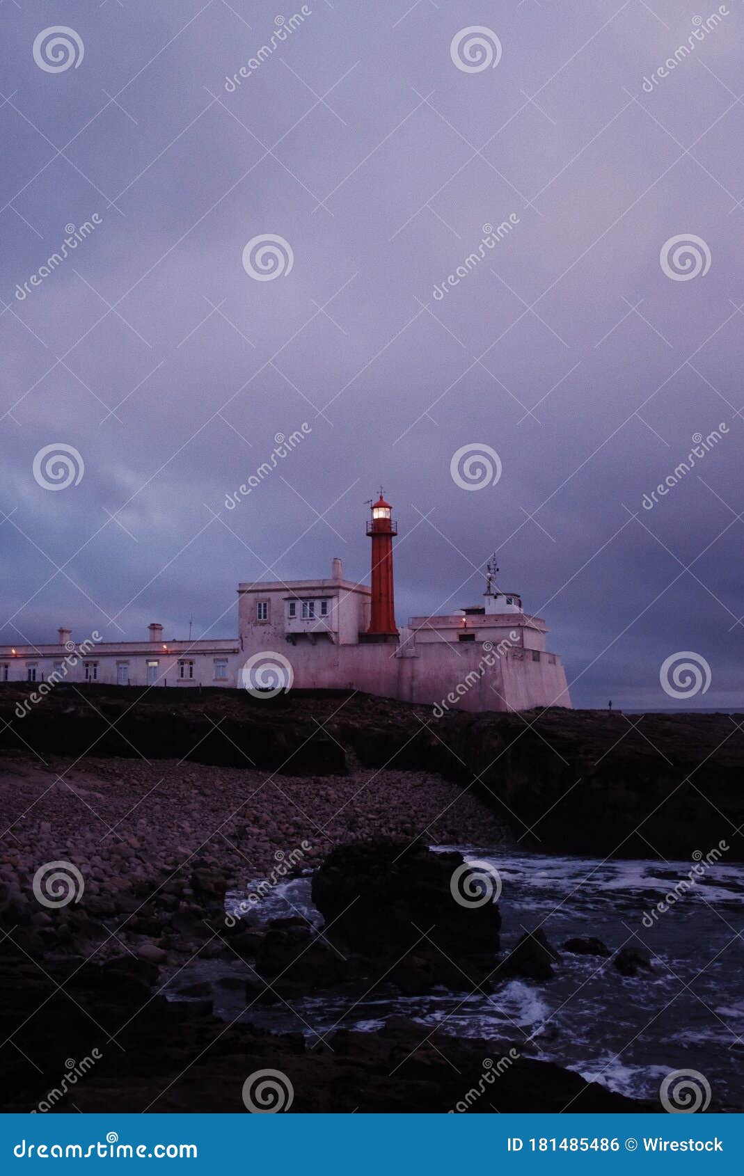 Vertical Shot of a Beautiful Scenery of Lighthouse after Sunset with ...