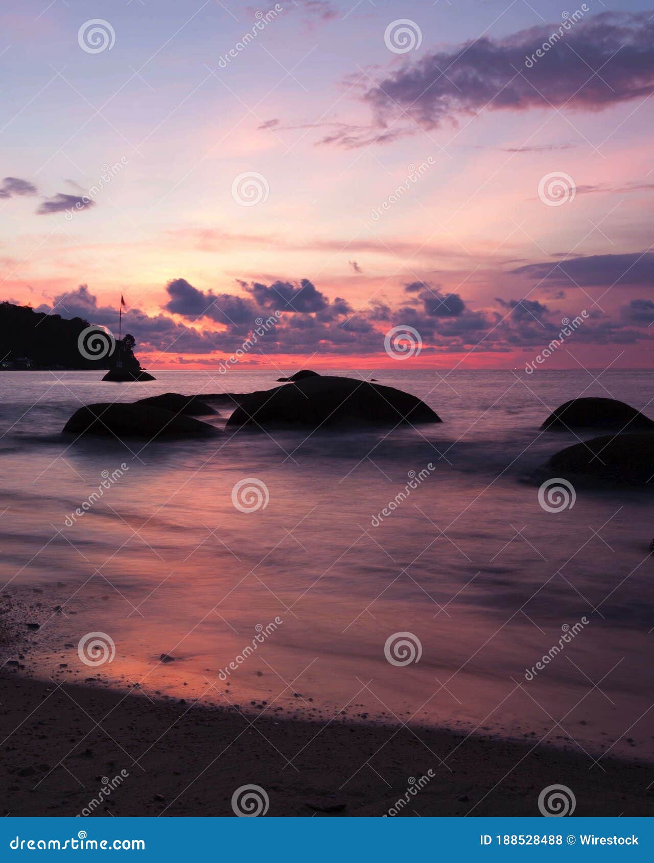 Vertical Shot of a Beautiful Sunset at the Beach Stock Photo - Image of ...