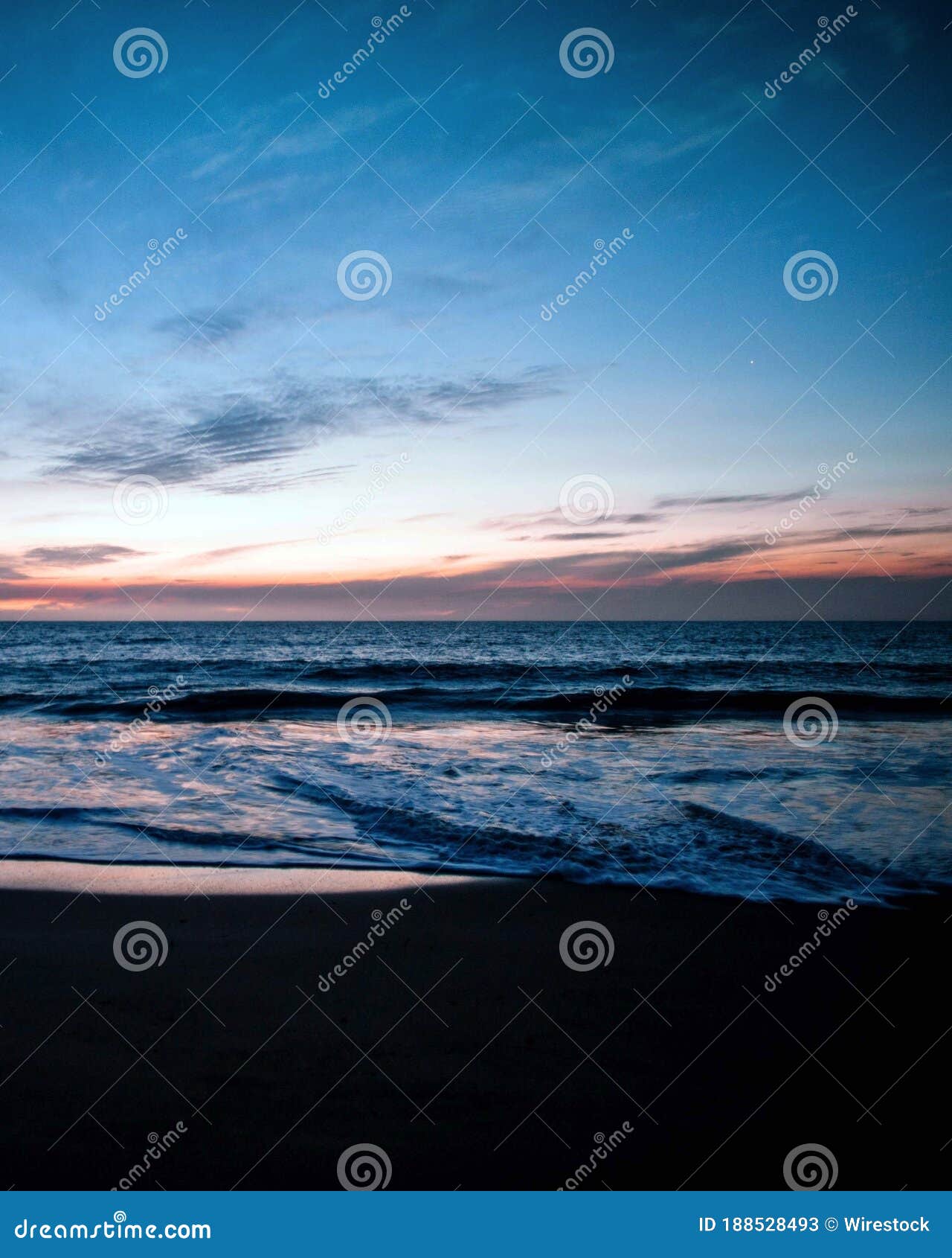 Vertical Shot of a Beautiful Sunset at the Beach Stock Image - Image of ...