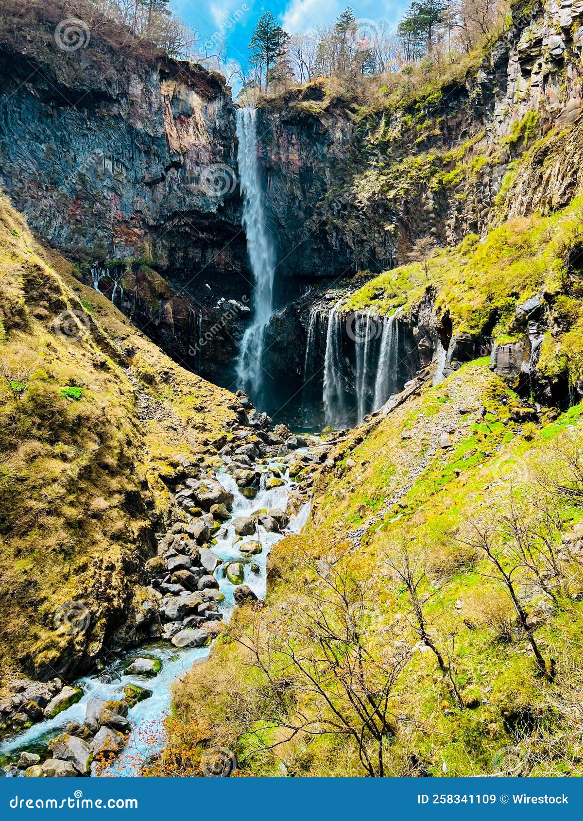 Vertical Shot of a Beautiful Waterfall Streaming Down a Cliff Stock ...