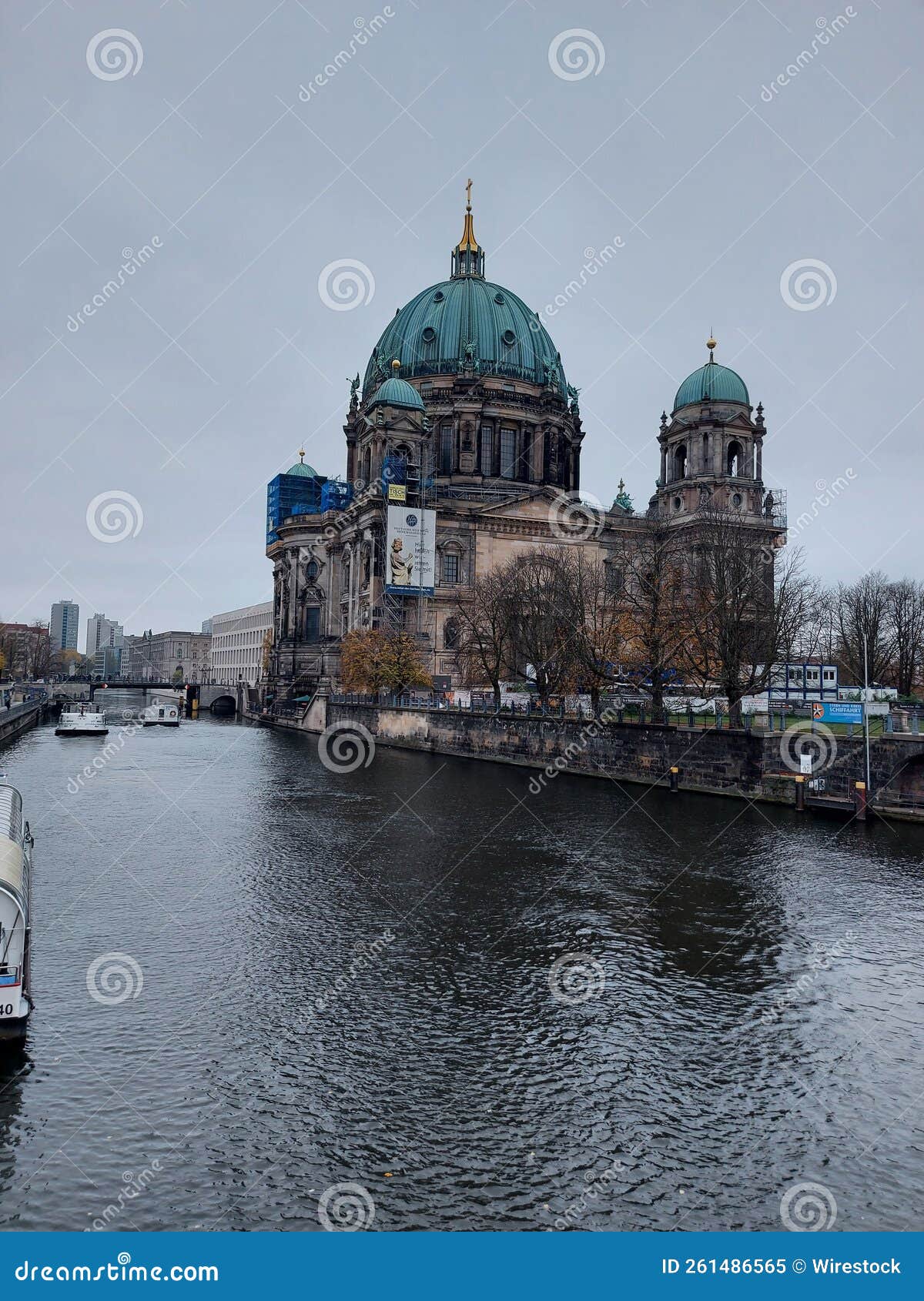 Vertical Shot of the Berlin Cathedral Facade with Blue Round Roofs in ...