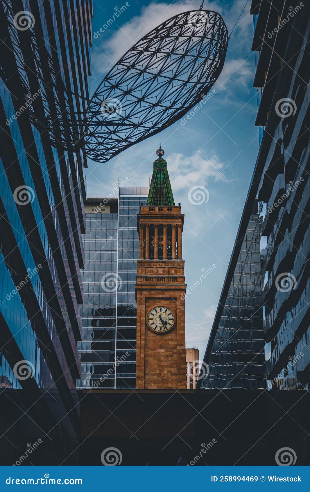 Vertical Shot of a Big Ben Clock Tower through Telstra One Building ...
