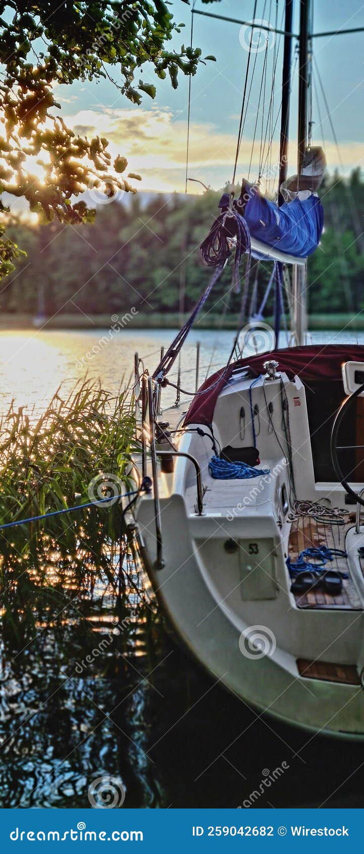 Vertical Shot of a Boat at Sunset Stock Photo - Image of port, nature ...