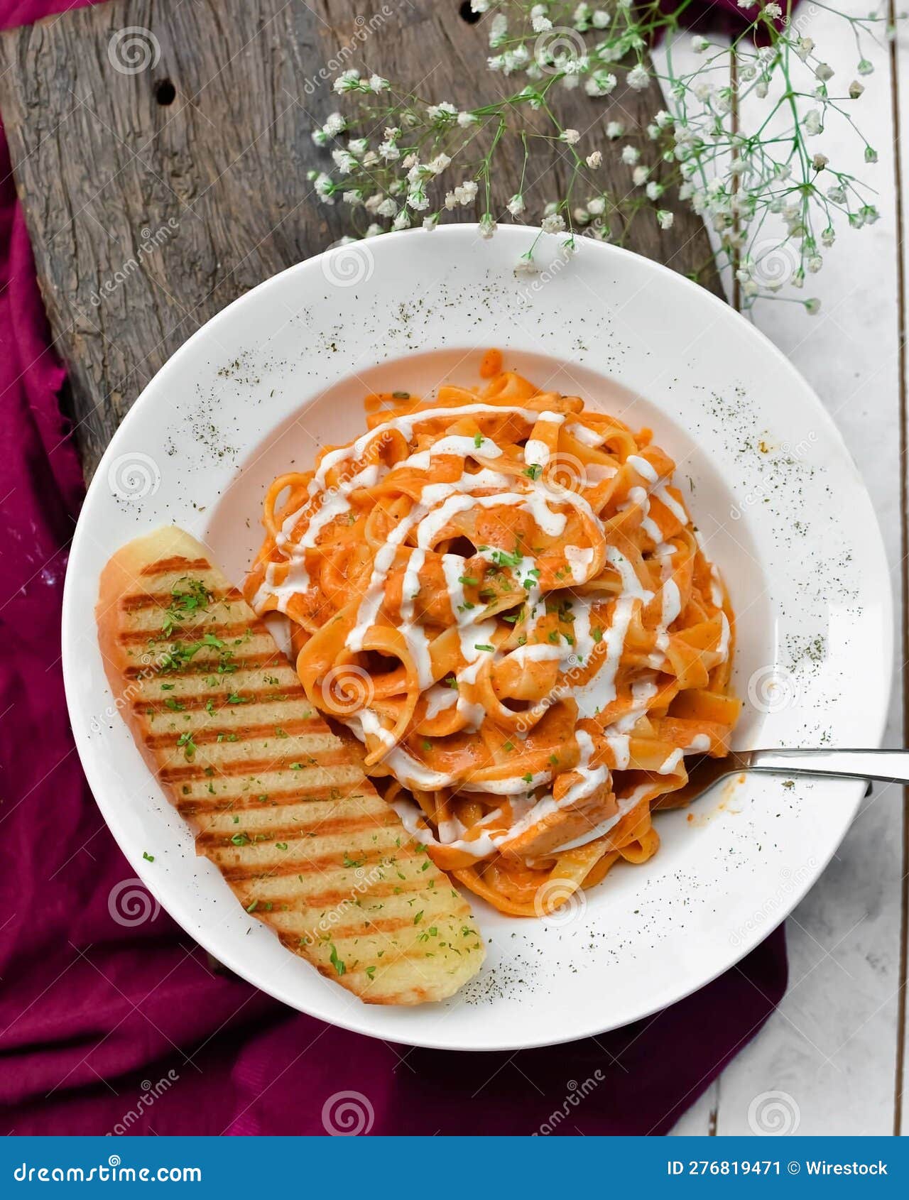 Vertical Shot of a Bowl of Delicious Vodka Pasta with Toasted Bread on ...