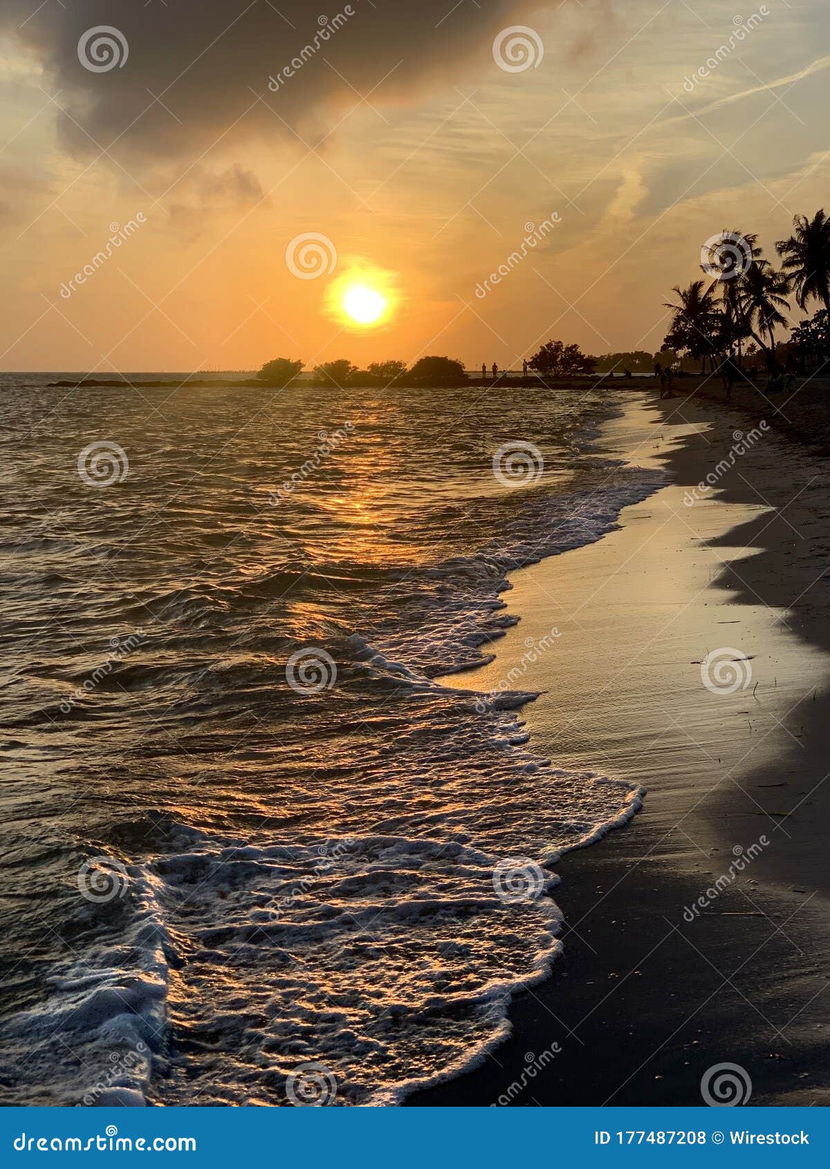 Vertical Shot of a Breathtaking Sunset Scenery in the Beach Stock Photo ...