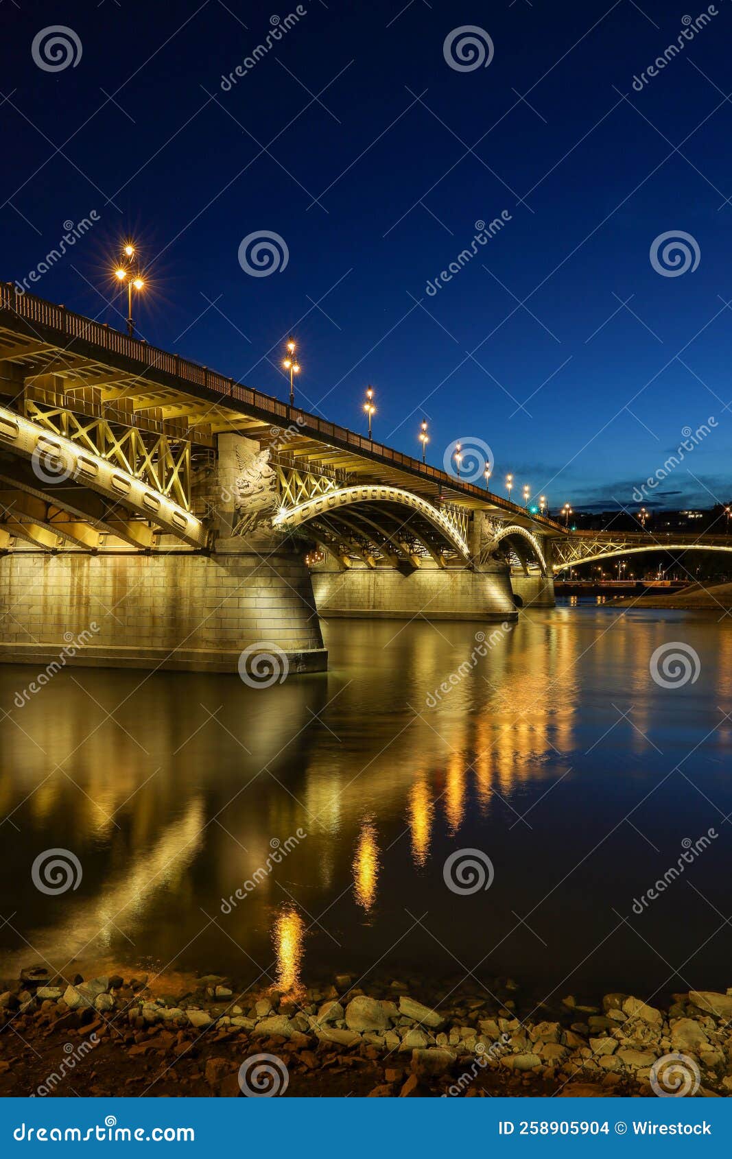 Vertical Shot of a Bridge in Lights at Night Stock Photo - Image of ...