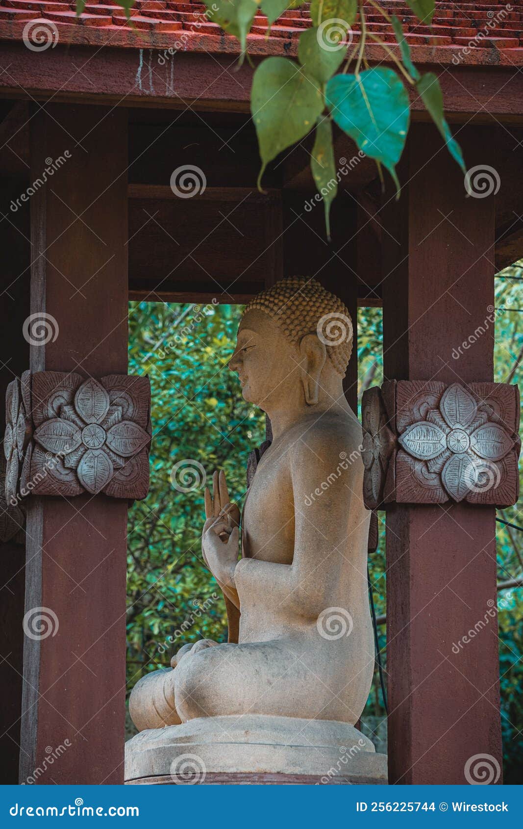 Vertical Shot of a Buddah Statue Outside a Temple Stock Photo - Image ...