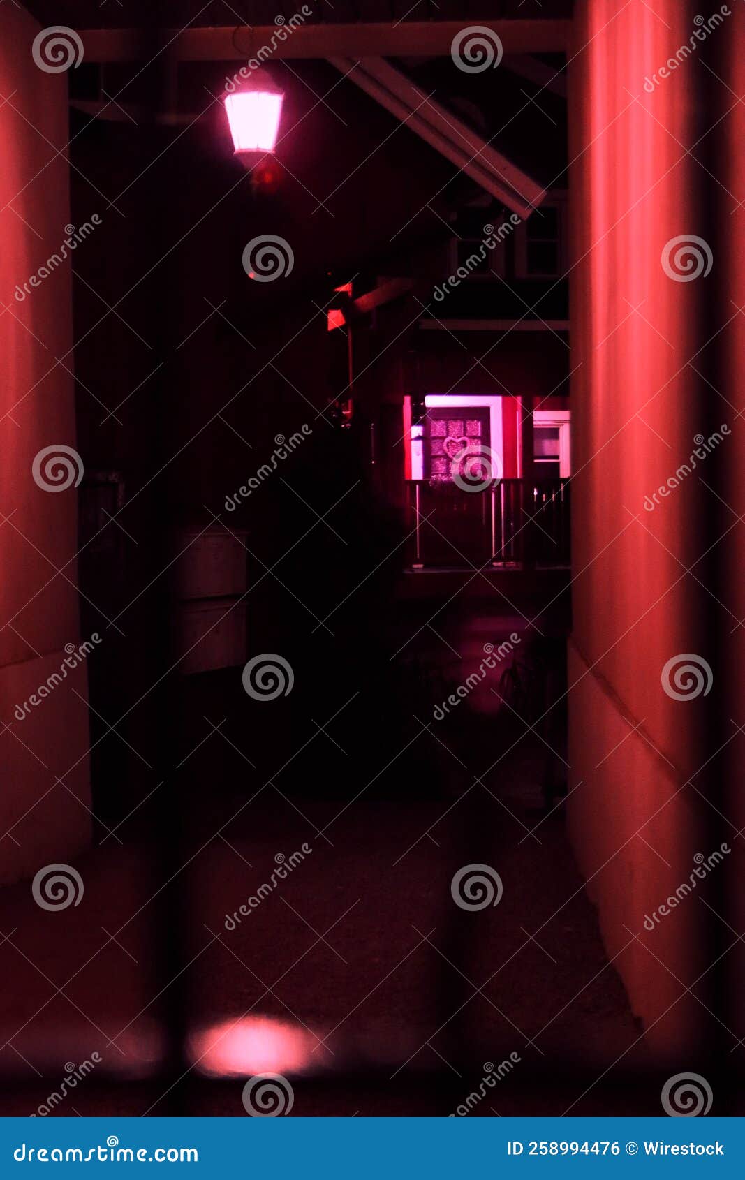 Vertical Shot of a Building Hall Covered with Red Light Stock Photo ...