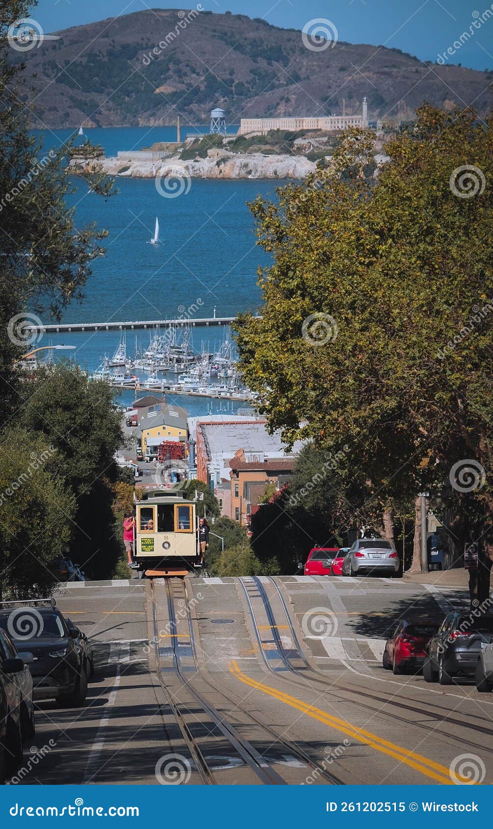 Vertical Shot of a Cable Car in San Francisco with Alcatraz in ...