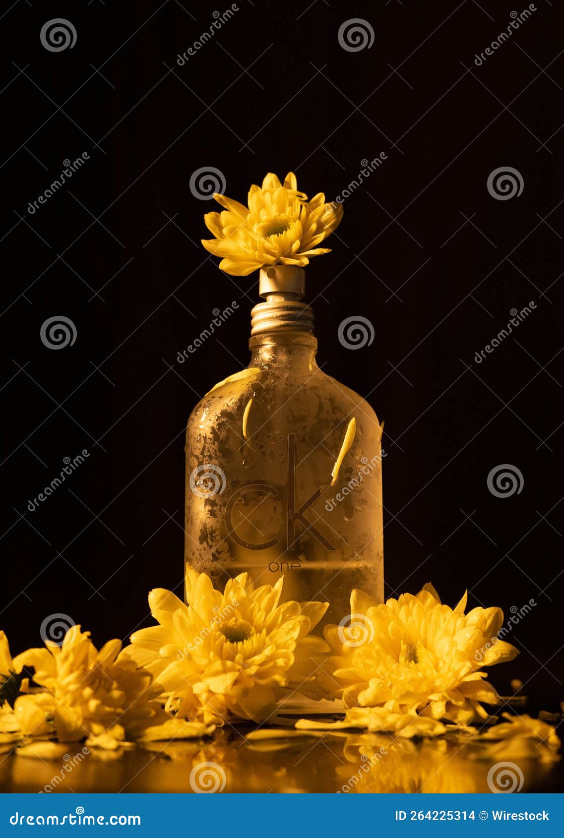 Vertical Shot of the Calvin Klein One Perfume with Flower Decorations ...