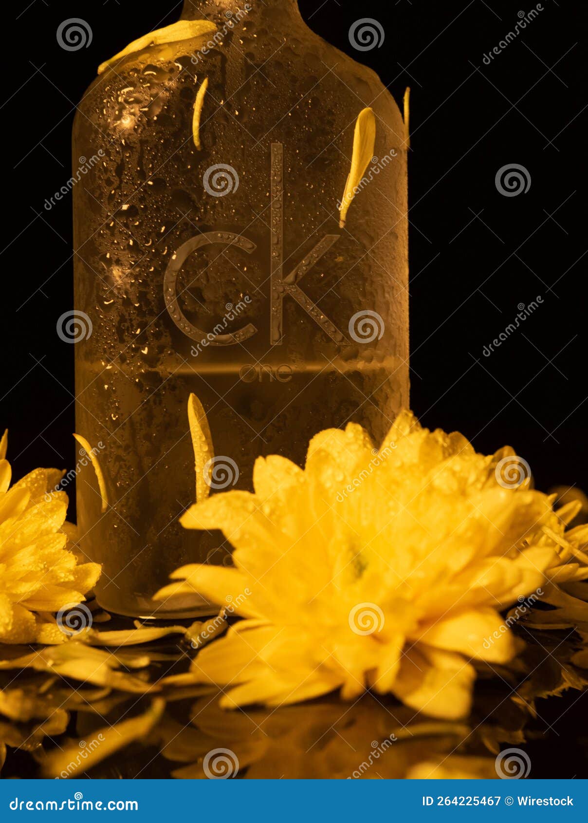 Vertical Shot of the Calvin Klein One Perfume with Flower Decorations ...