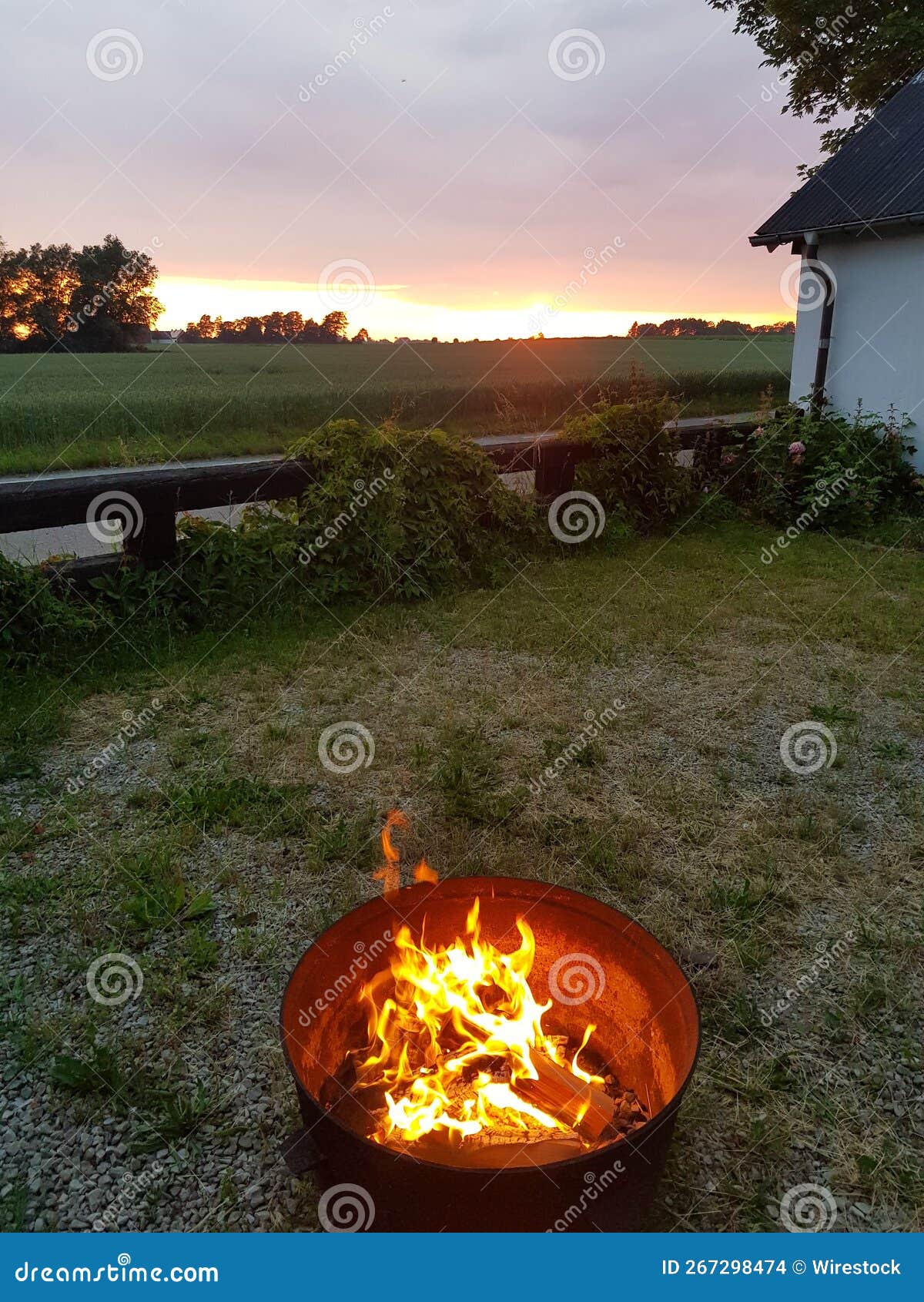 Vertical Shot of a Campfire on the Backyard of the House at Sunset ...