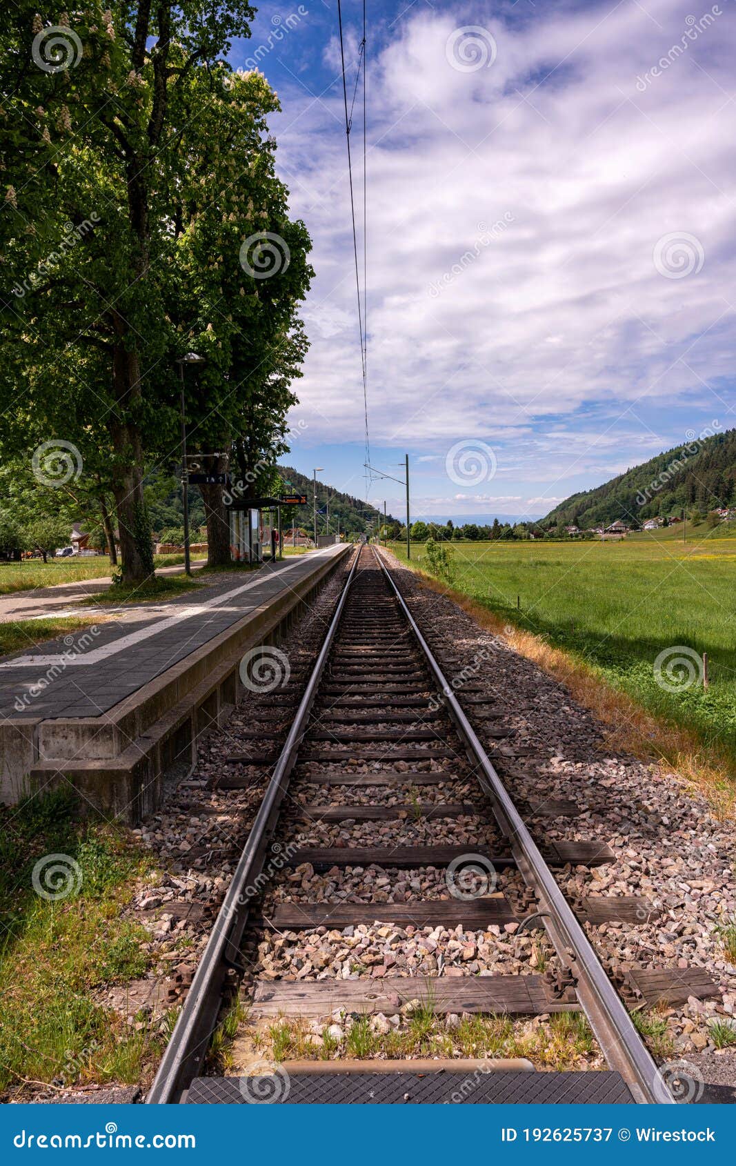 Vertical Shot Capturing Train Tracks Under the Blue Sky Stock Image ...