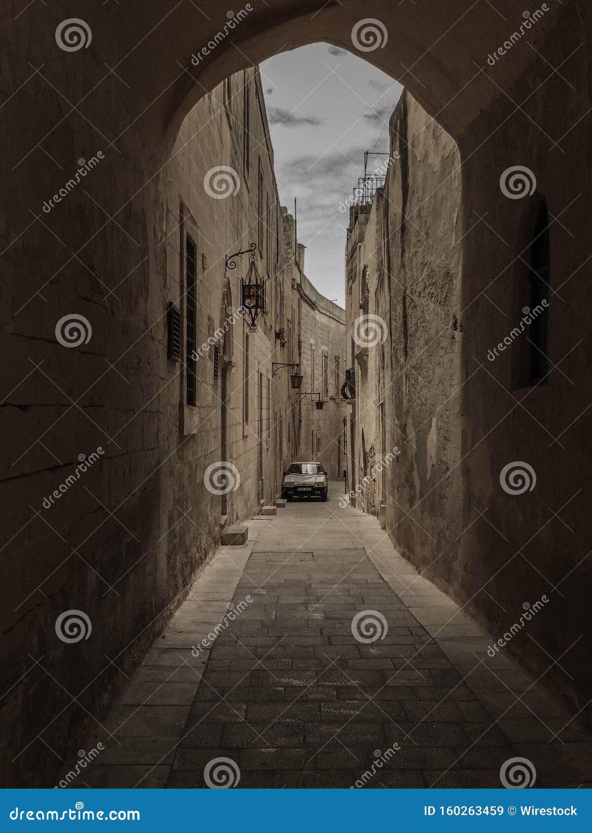 Vertical Shot of a Car Parked on a Narrow Pathway in the Middle of ...