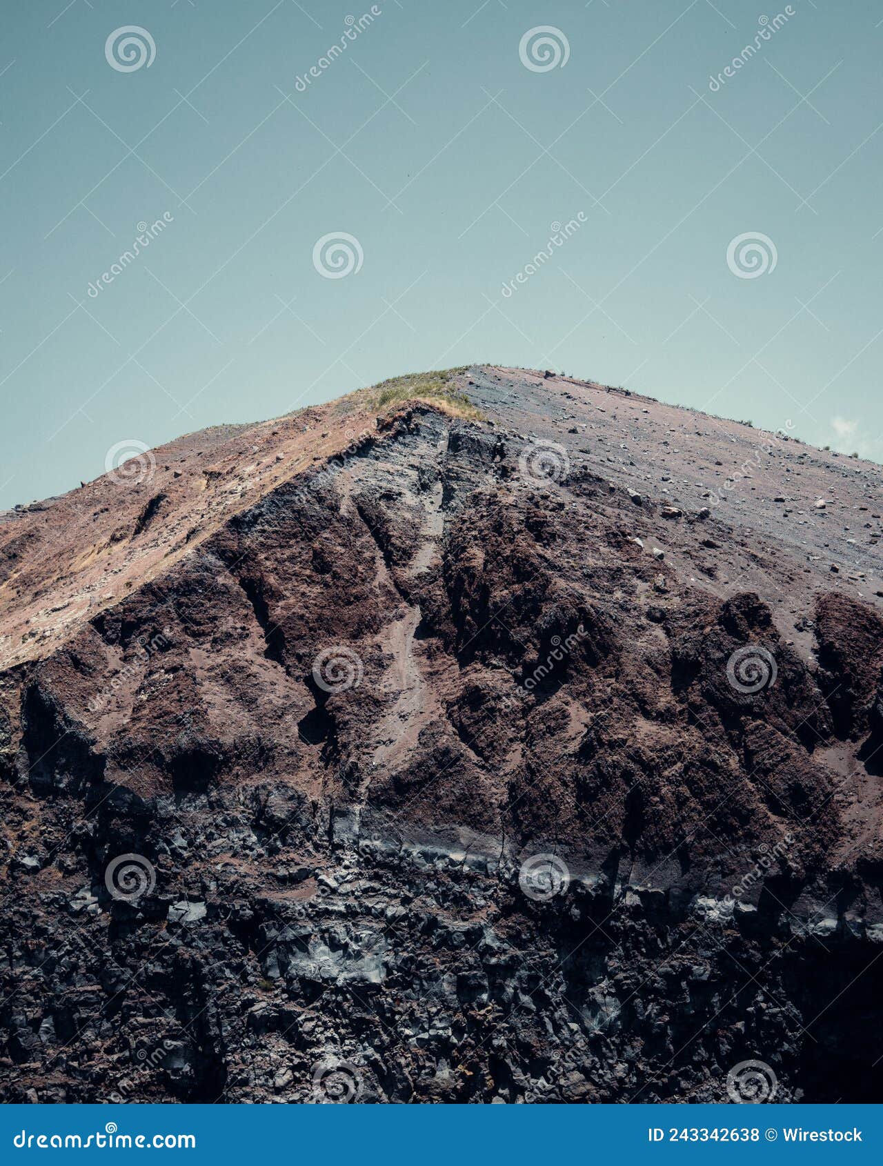 Vertical Shot of a Cliff in the Background of the Sky. Stock Photo ...