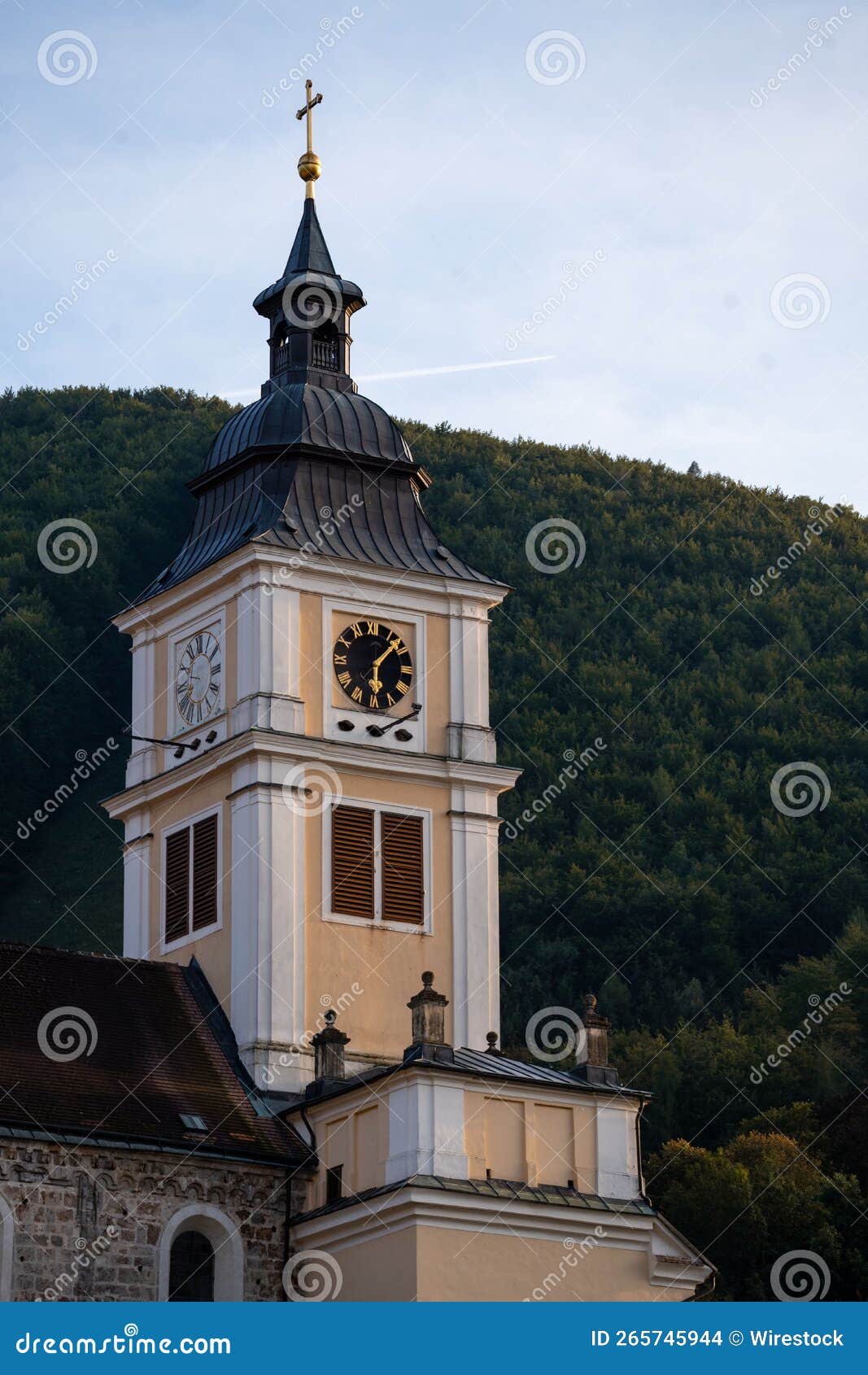 Vertical Shot of a Clock Tower of a Monastery in an Alpine Town in ...