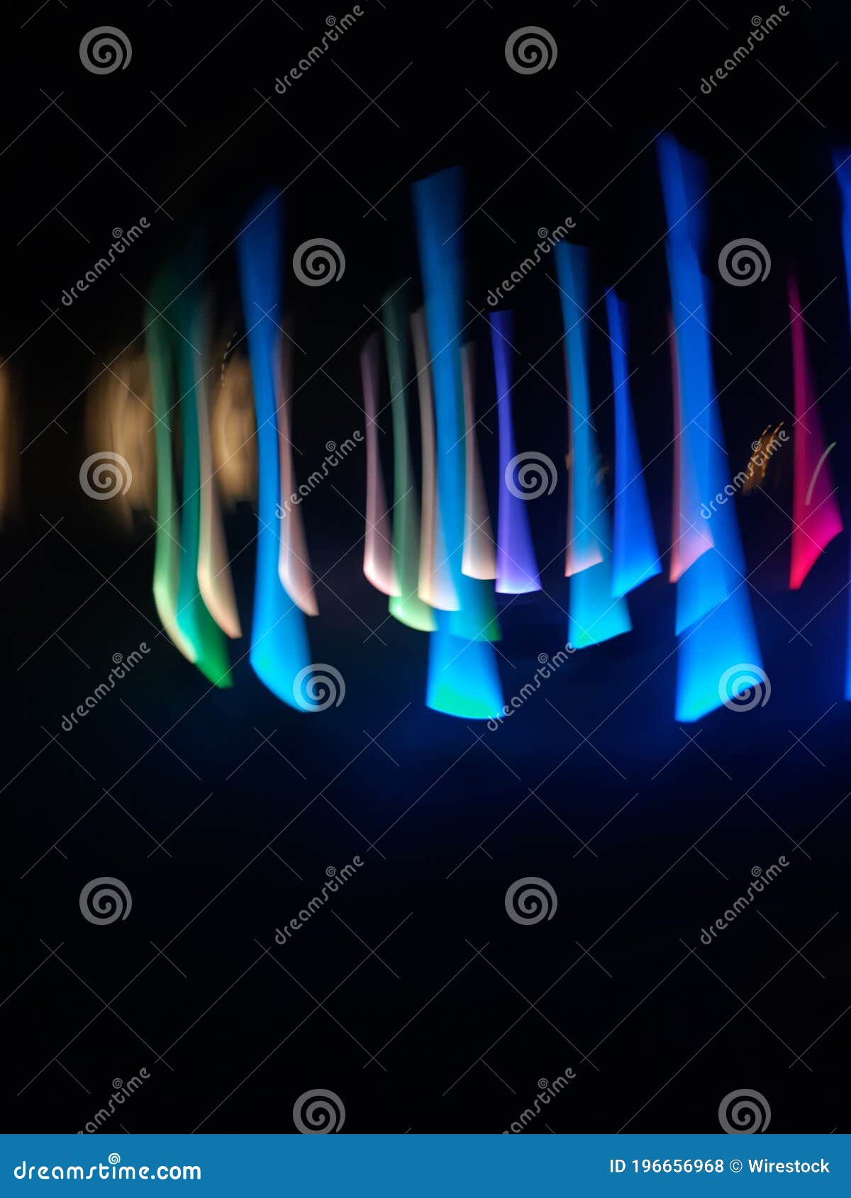 Vertical Shot of Colorful Light Pillars Against a Dark Background Stock ...