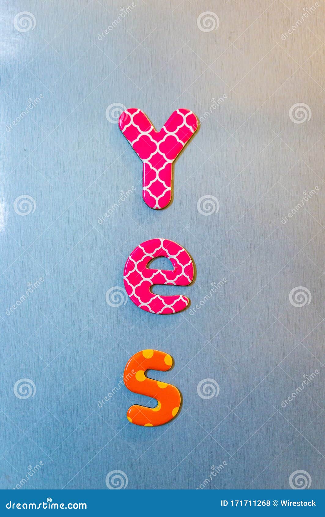 Vertical Shot of Colorful Words Spelling Out Yes in a Line Stock Photo ...