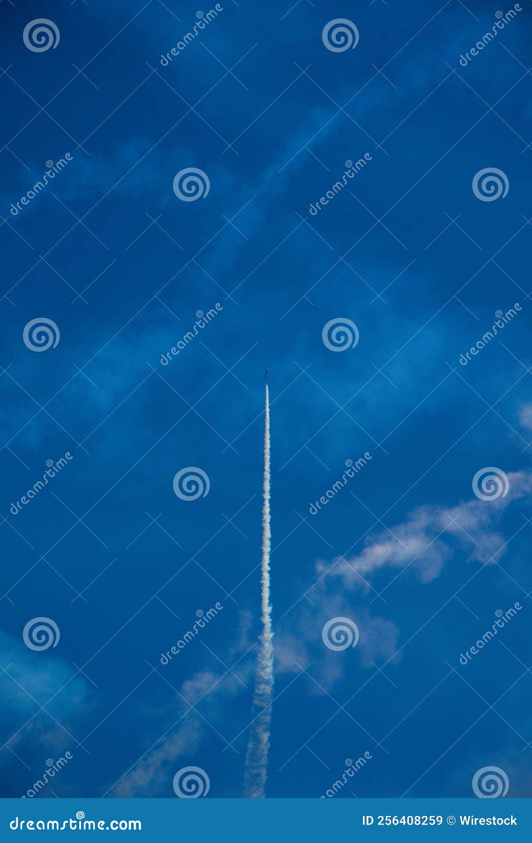 Vertical Shot of Contrail Plain with a Line-shaped Cloud Formation on ...