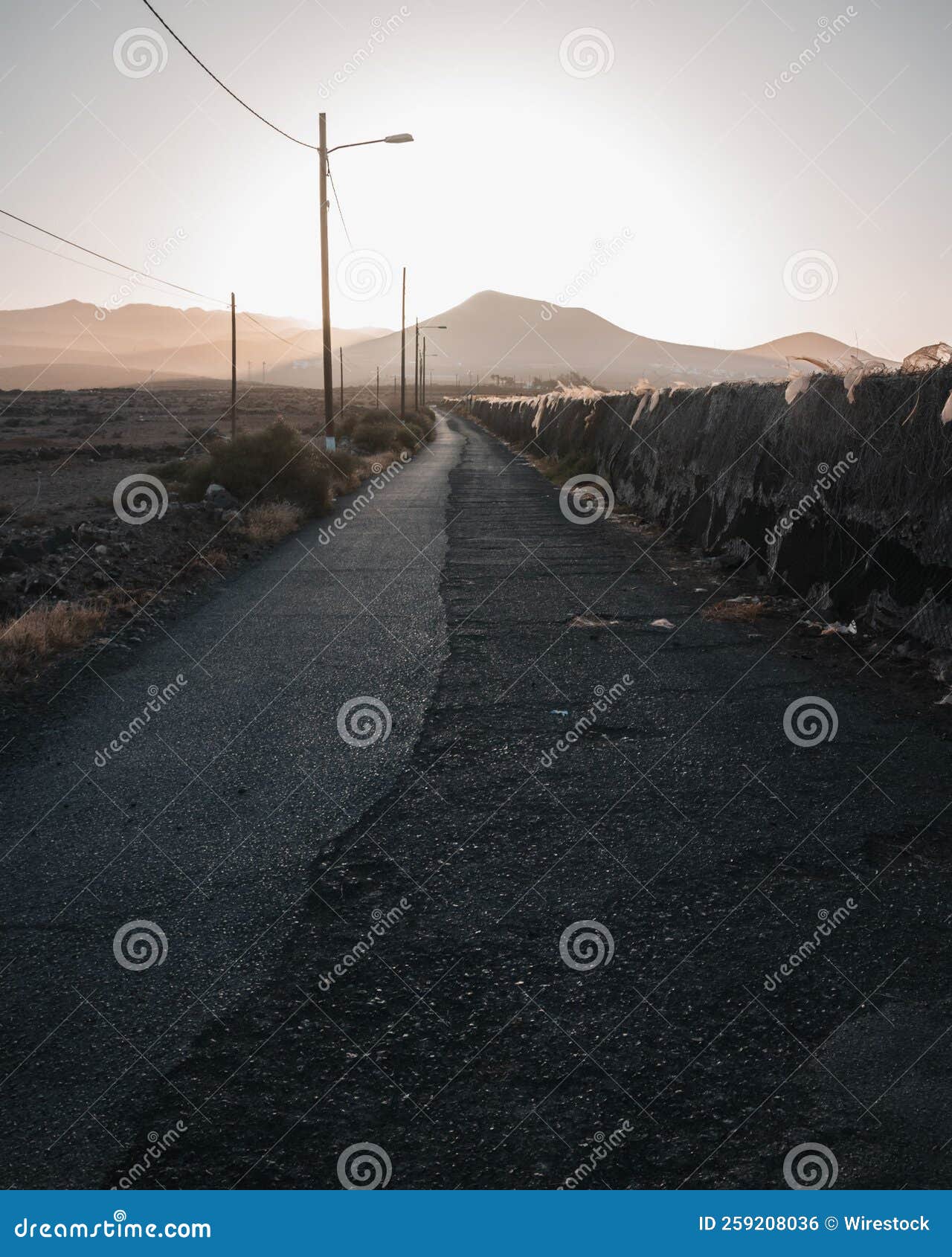 Vertical Shot of a Countryside Road during Sunset with Mountains and ...
