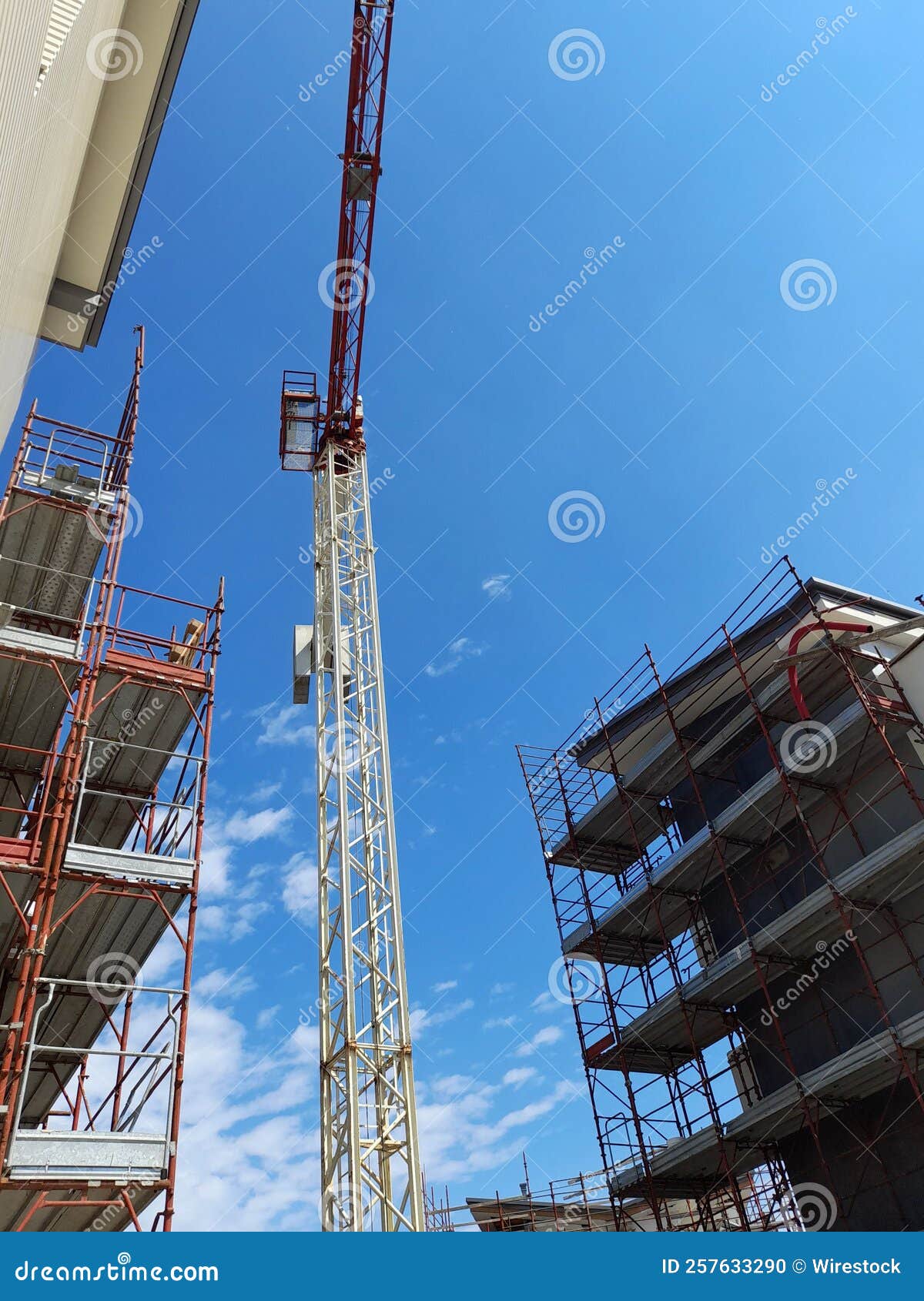 Vertical Shot of a Crane at a Construction Site Stock Photo - Image of ...