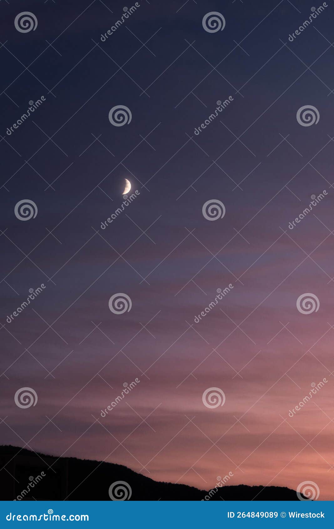 Vertical Shot of the Crescent Moon in the Sky at Sunset Stock Image ...
