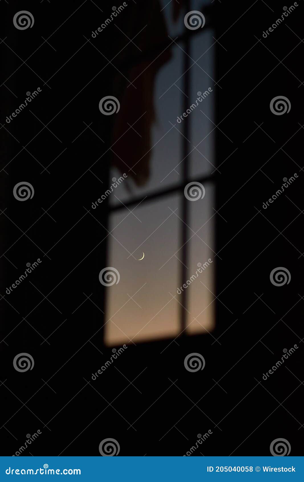 Vertical Shot of a Crescent Moon Visible from a Window Stock Photo ...