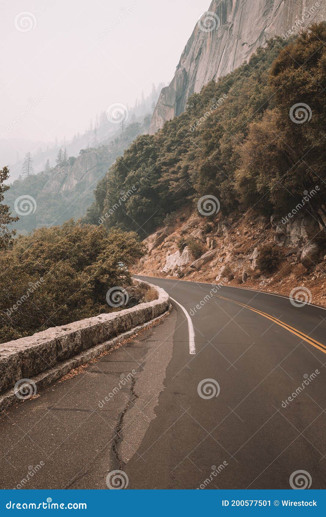 Vertical Shot of Curved Asphalt Road with a Cliff on the Side Stock ...
