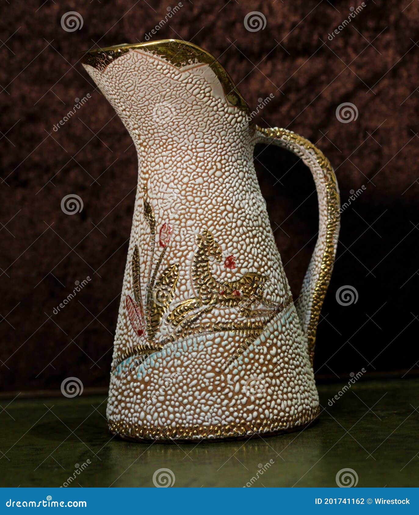 Vertical Shot of a Decorated Vintage Jug on the Table with a Blurry ...