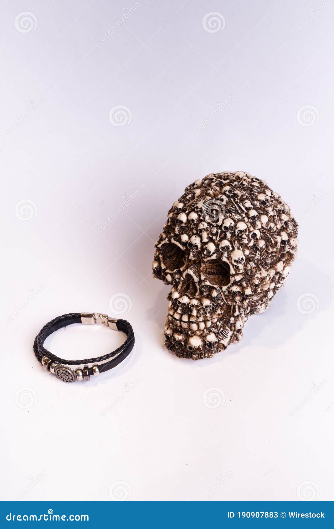Vertical Shot of a Decorative Skull Made of Smaller Skulls and a ...