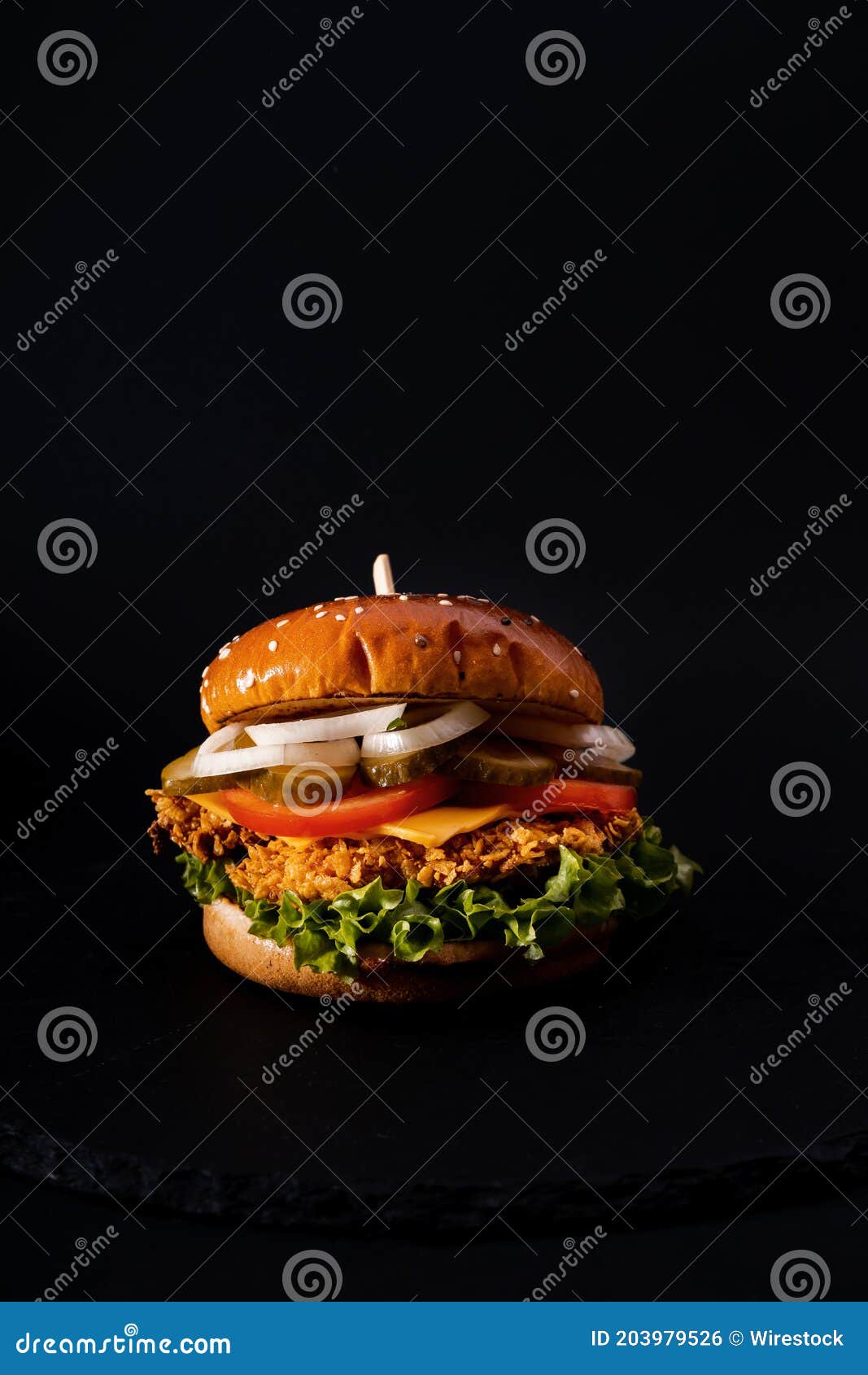 Vertical Shot of a Delicious Burger on a Black Surface Stock Photo ...