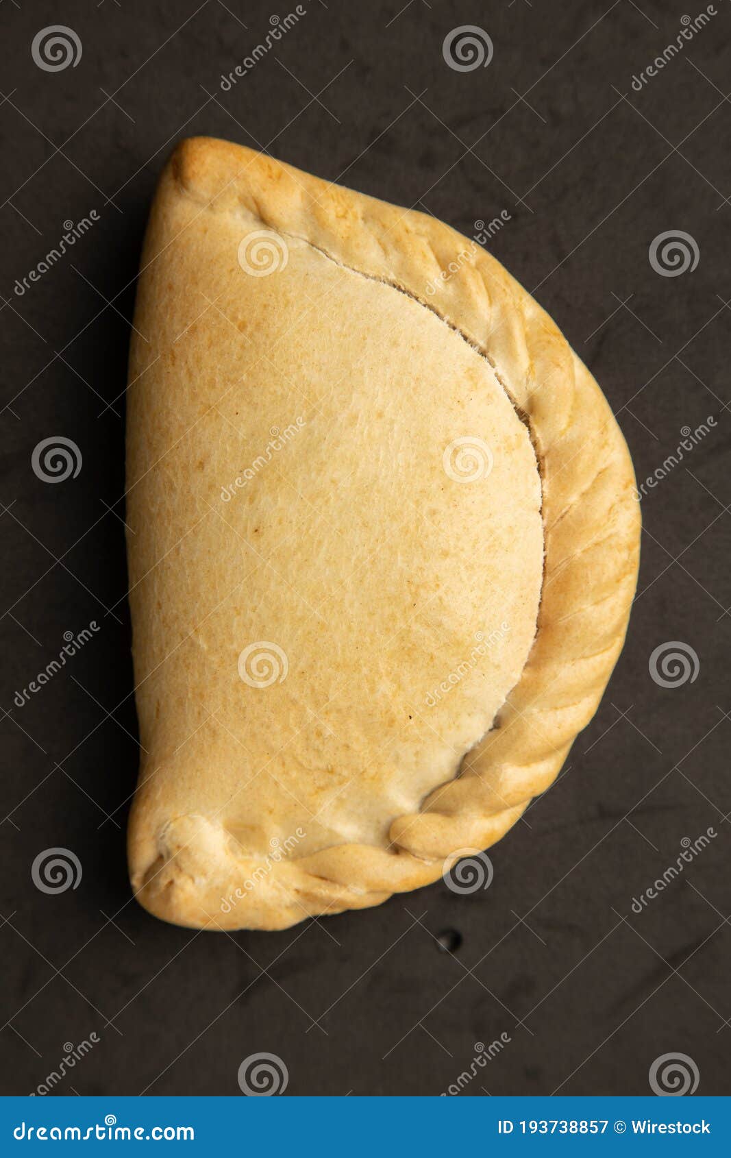 Vertical Shot of a Delicious Empanada Isolated on a Black Surface Stock ...
