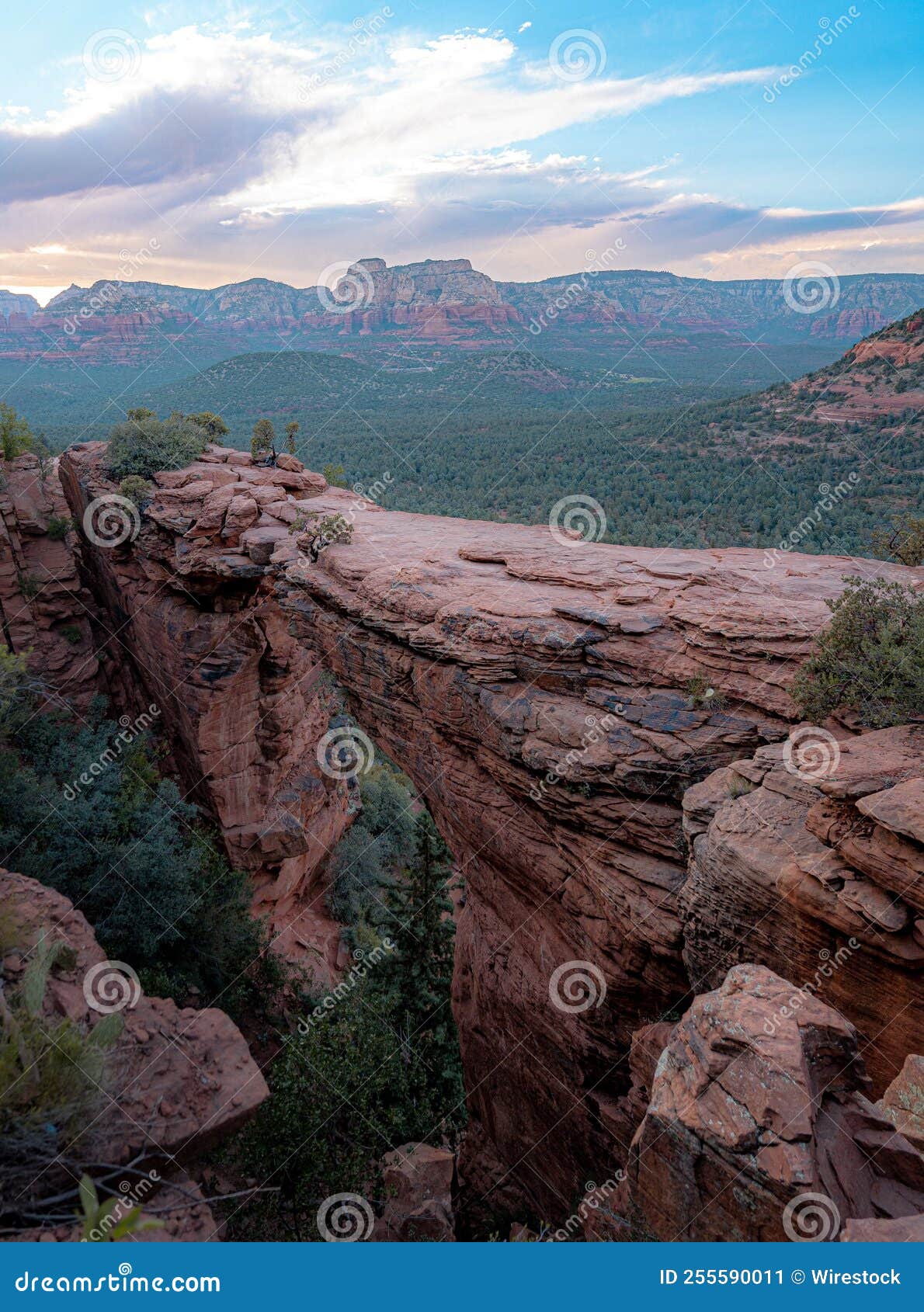 Vertical Shot of Devils Bridge at Sedona Arizona with Mountains and a ...