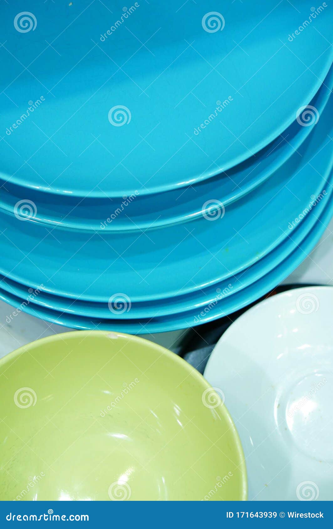 Vertical Shot of Different Color Plates Stock Image - Image of brown ...