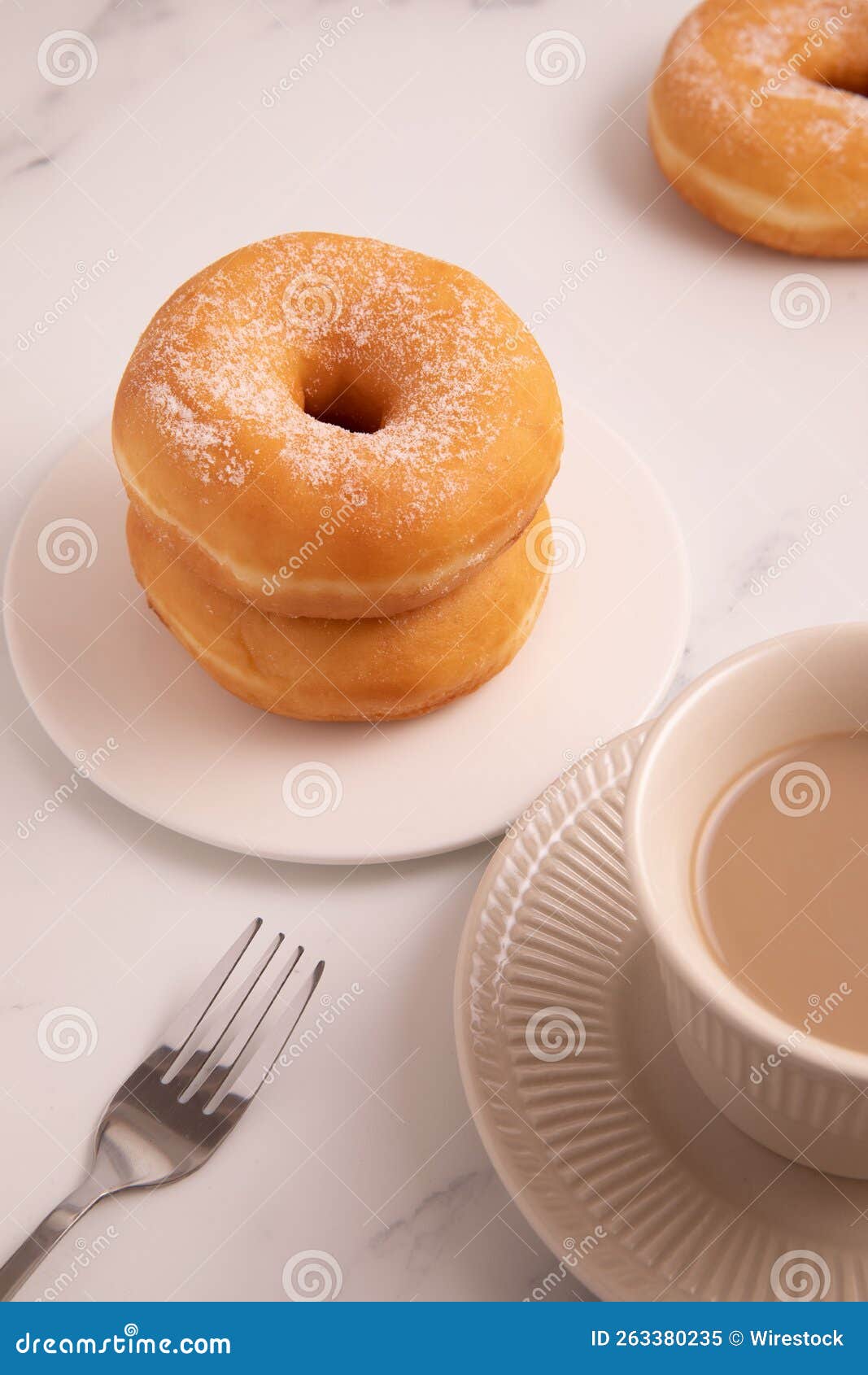 Vertical Shot of Donuts Served with Coffee on a White Table Stock Image ...