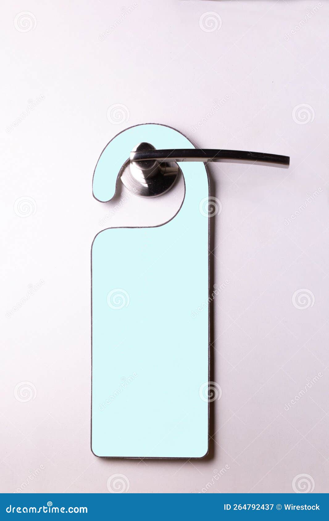 Vertical Shot of a Door Hanger on a Silver Handle Stock Image - Image ...